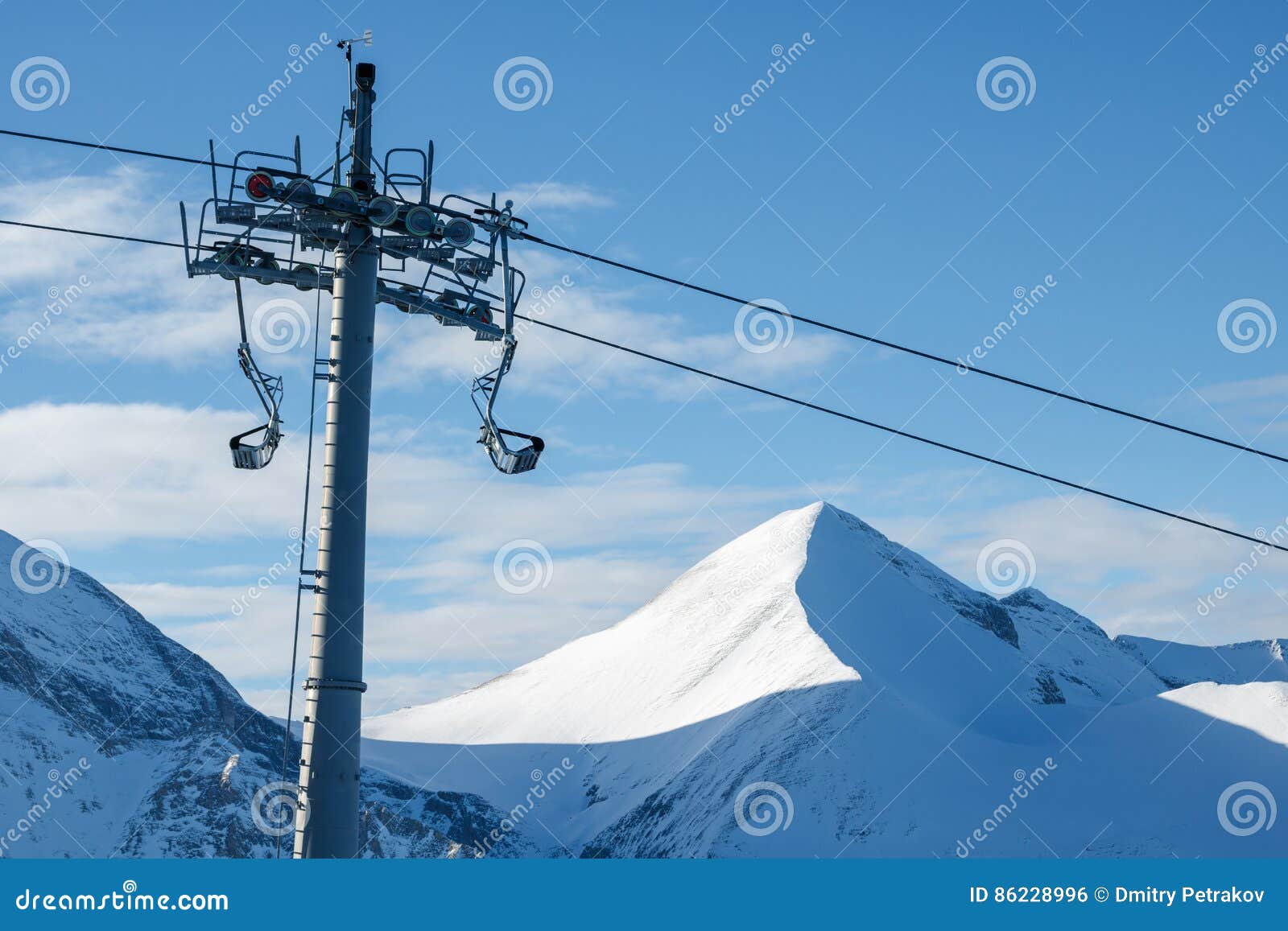 Chair Lift on a Background of Mountains and Sky Stock Photo - Image of ...