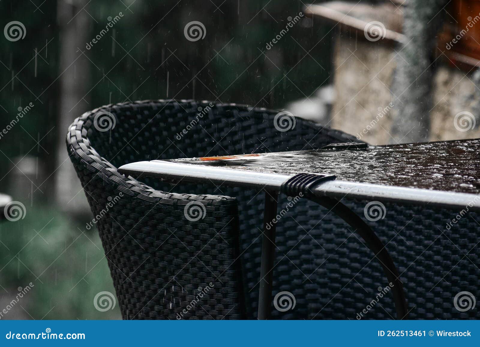 Chair and table under rain stock image. Image of furniture - 262513461