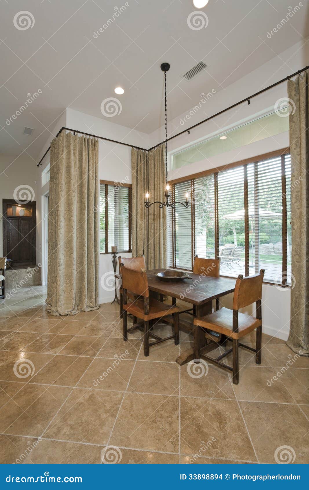 Chairs with Dining Table on Tiled Floor Stock Photo - Image of chairs ...