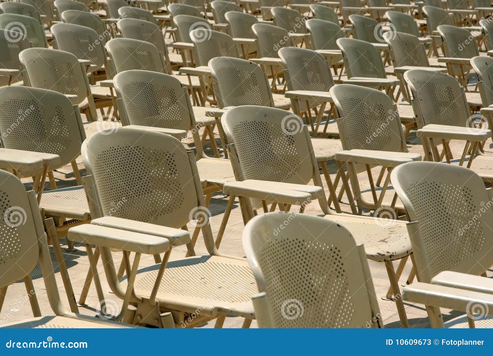 Chairs in a rows stock image. Image of beige, lines, yellow - 10609673