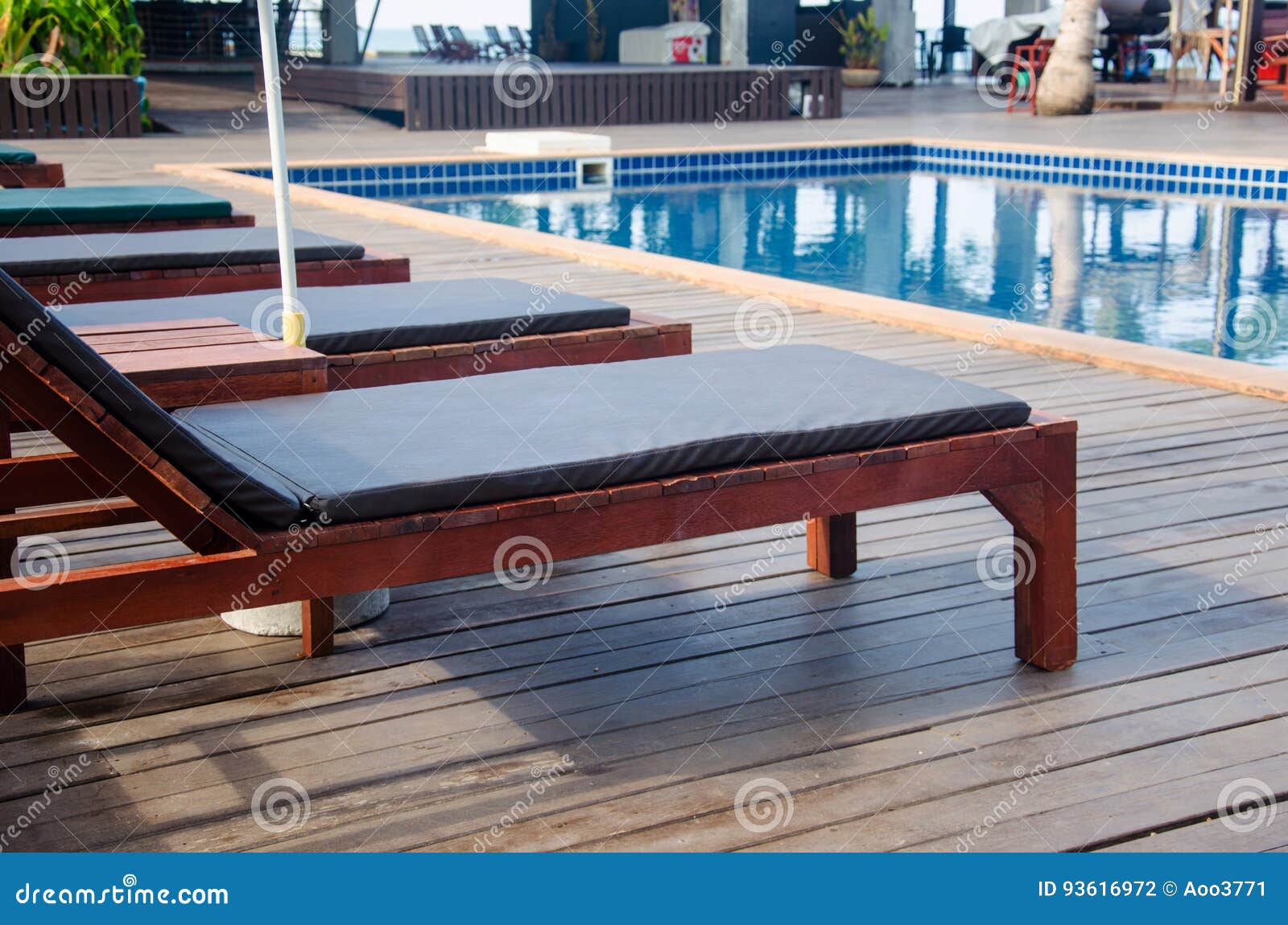 Chairs swimming pool stock photo. Image of beautiful - 93616972