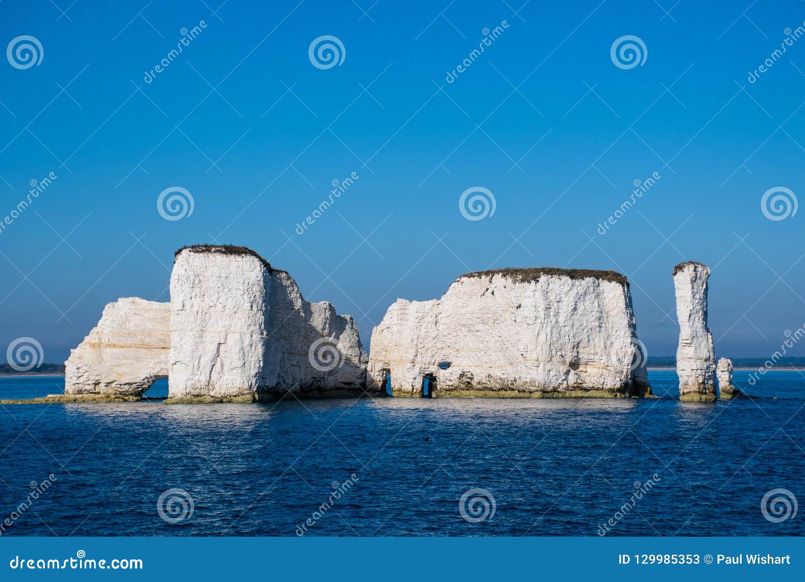 Chalk Cliff Face with Cave at Bottom Stock Image - Image of face ...