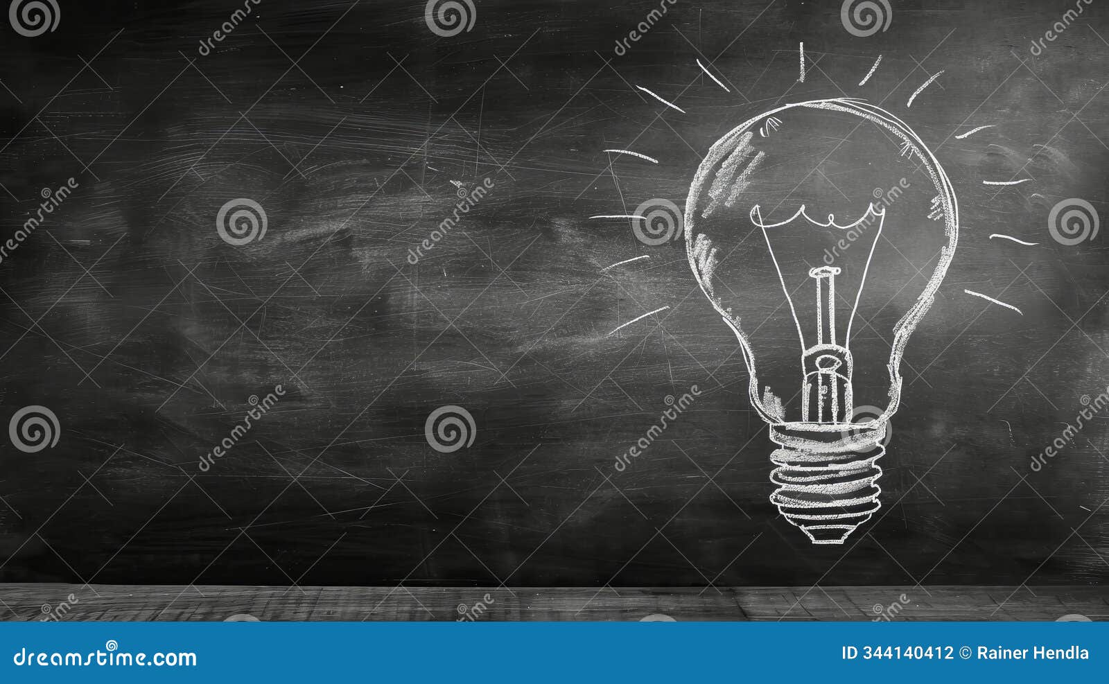 Chalk Drawing of a Light Bulb on a Blackboard in a Classroom Setting ...