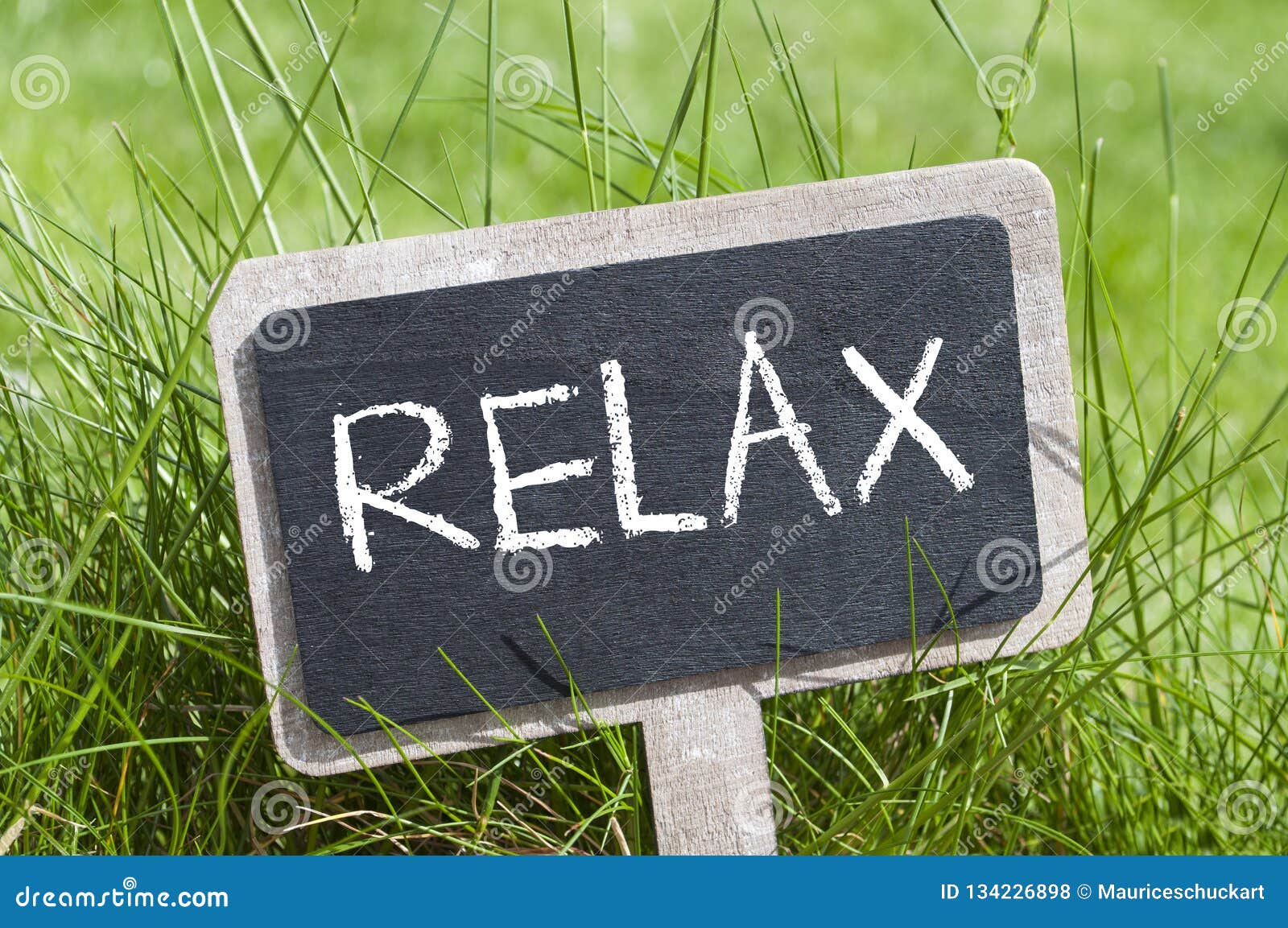 Chalkboard in the Grass with Relax Stock Photo - Image of message ...