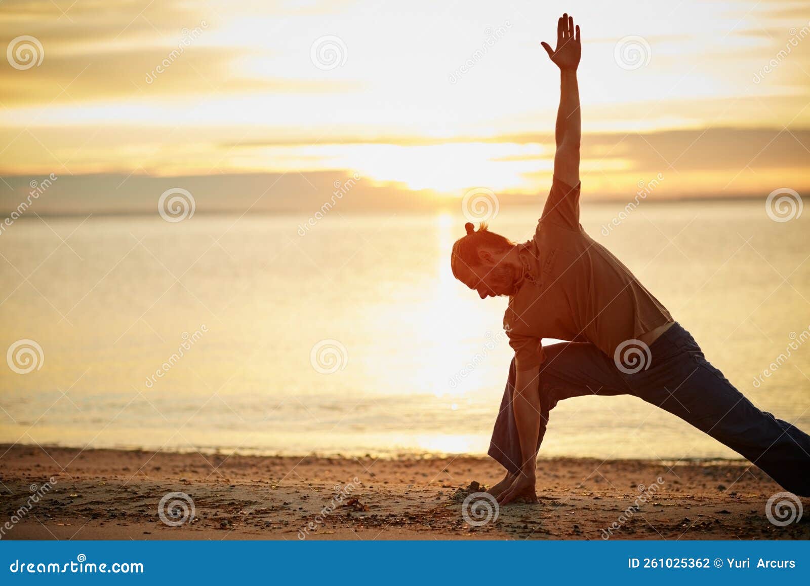 Challenge the Body, Quieten the Mind. a Man Practicing the Triangle ...