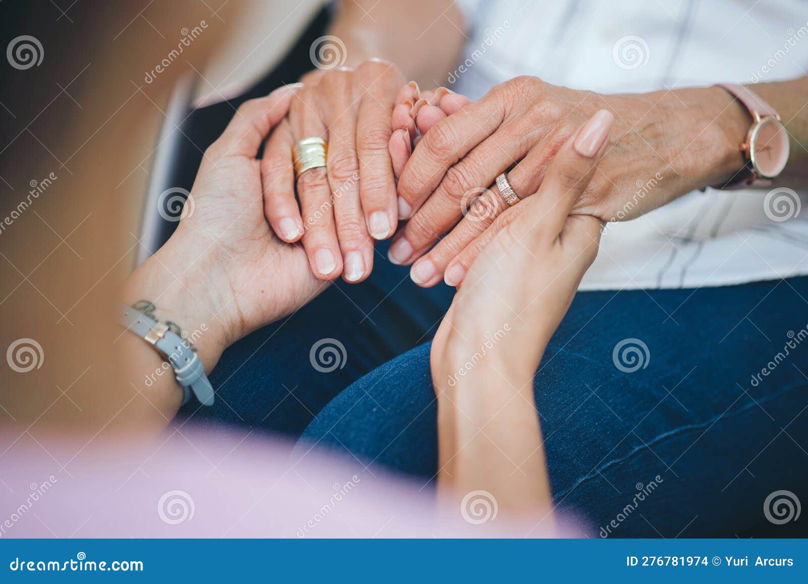 A Challenge Shared. a Two Unrecognizable People Holding Hands in ...