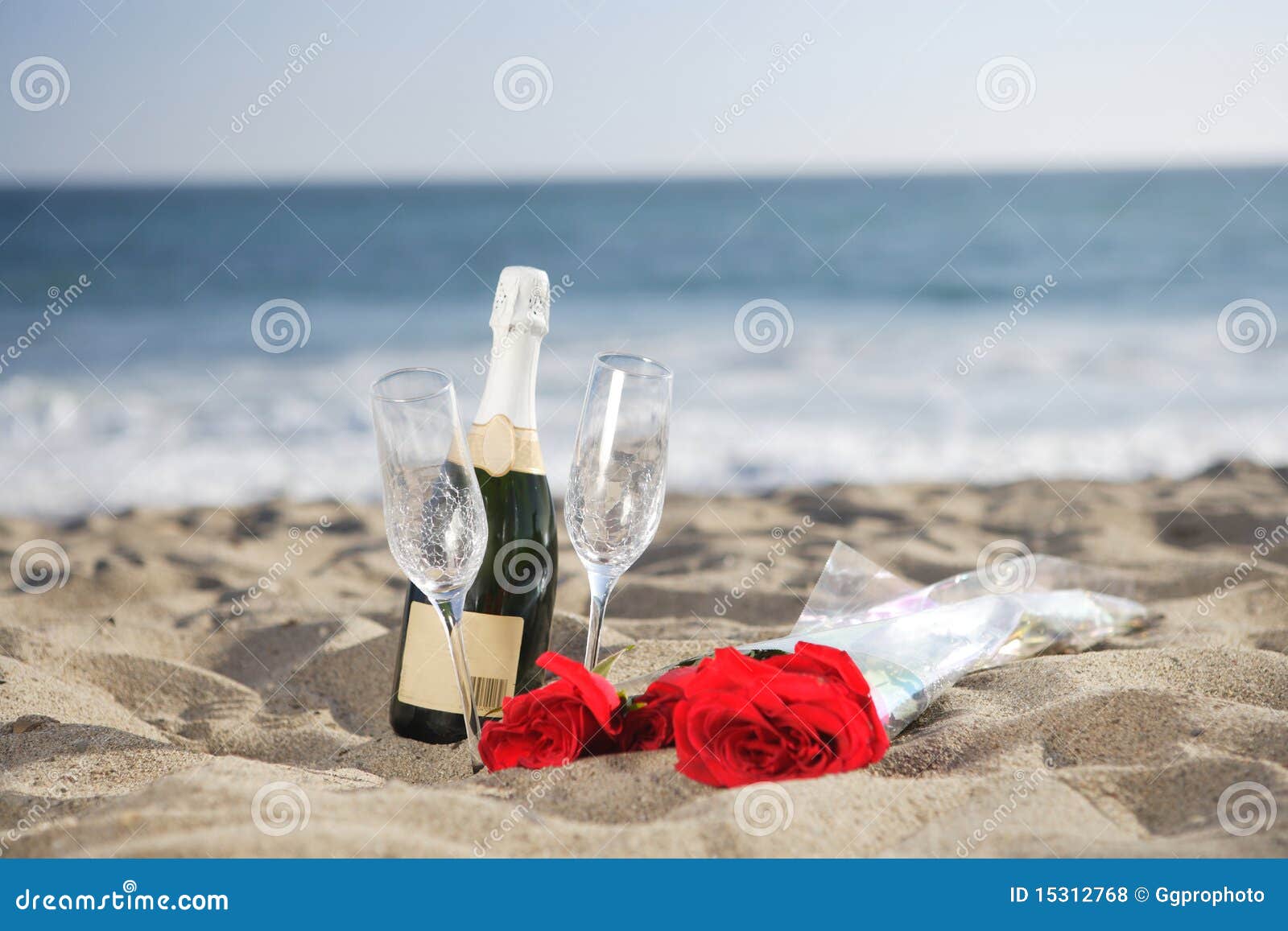 Champagne Bottle, Glasses, Roses at the Beach Stock Photo - Image of ...