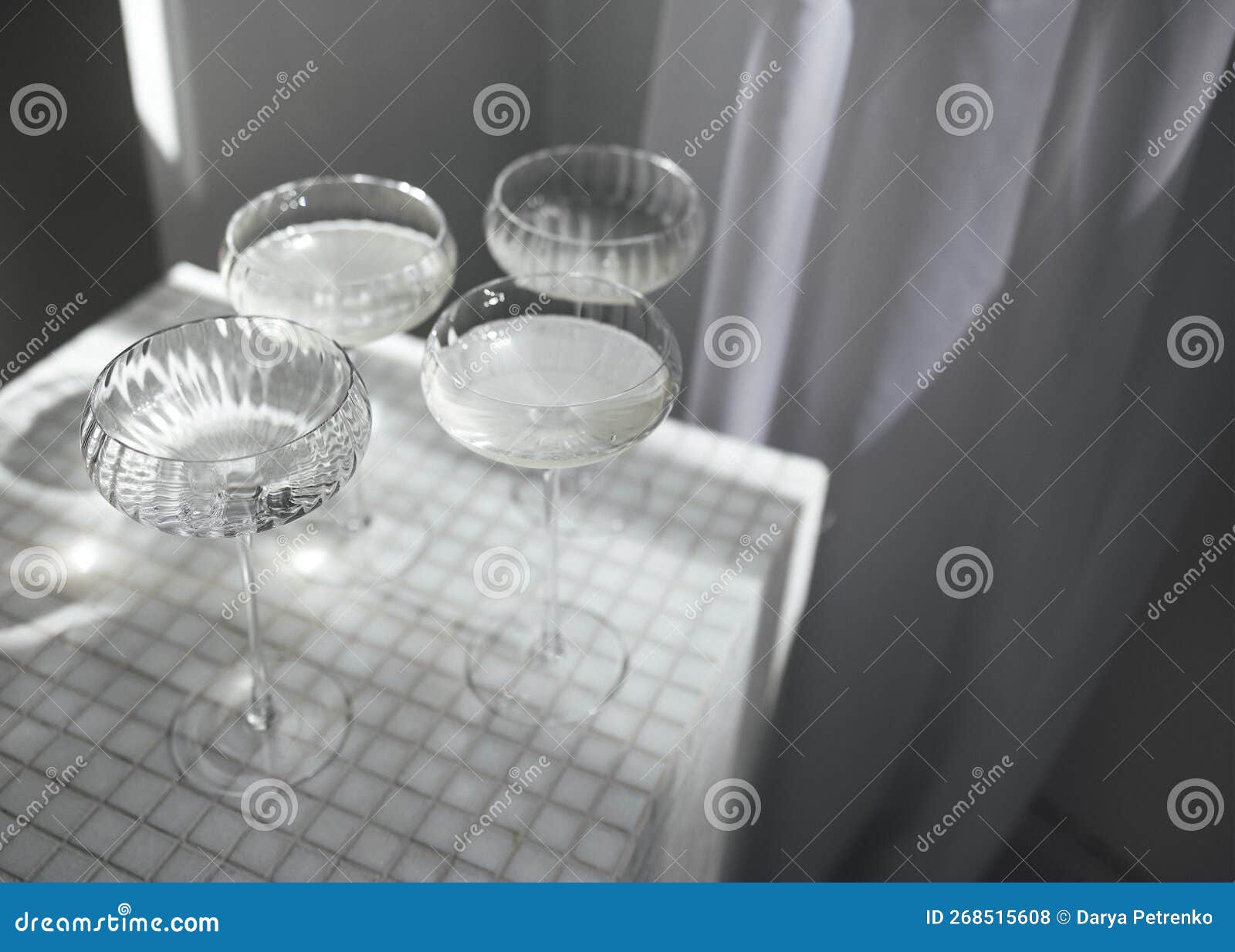 Champagne Glasses on a Light Table Surface Reflecting Soft Sunshine ...