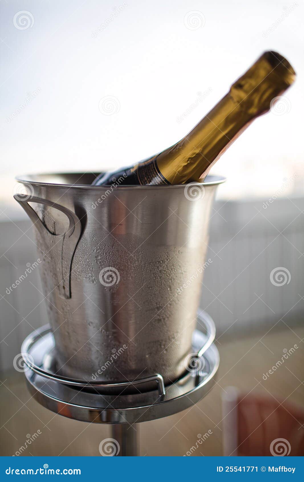 Champagne in a ice bucket stock image. Image of silver - 25541771