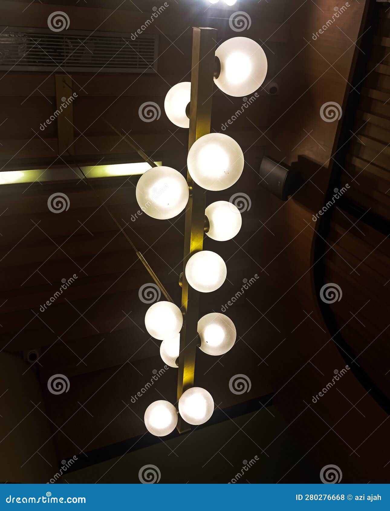 A Chandelier Designed with a Light Bulb Attached To an Iron Rod Stock ...