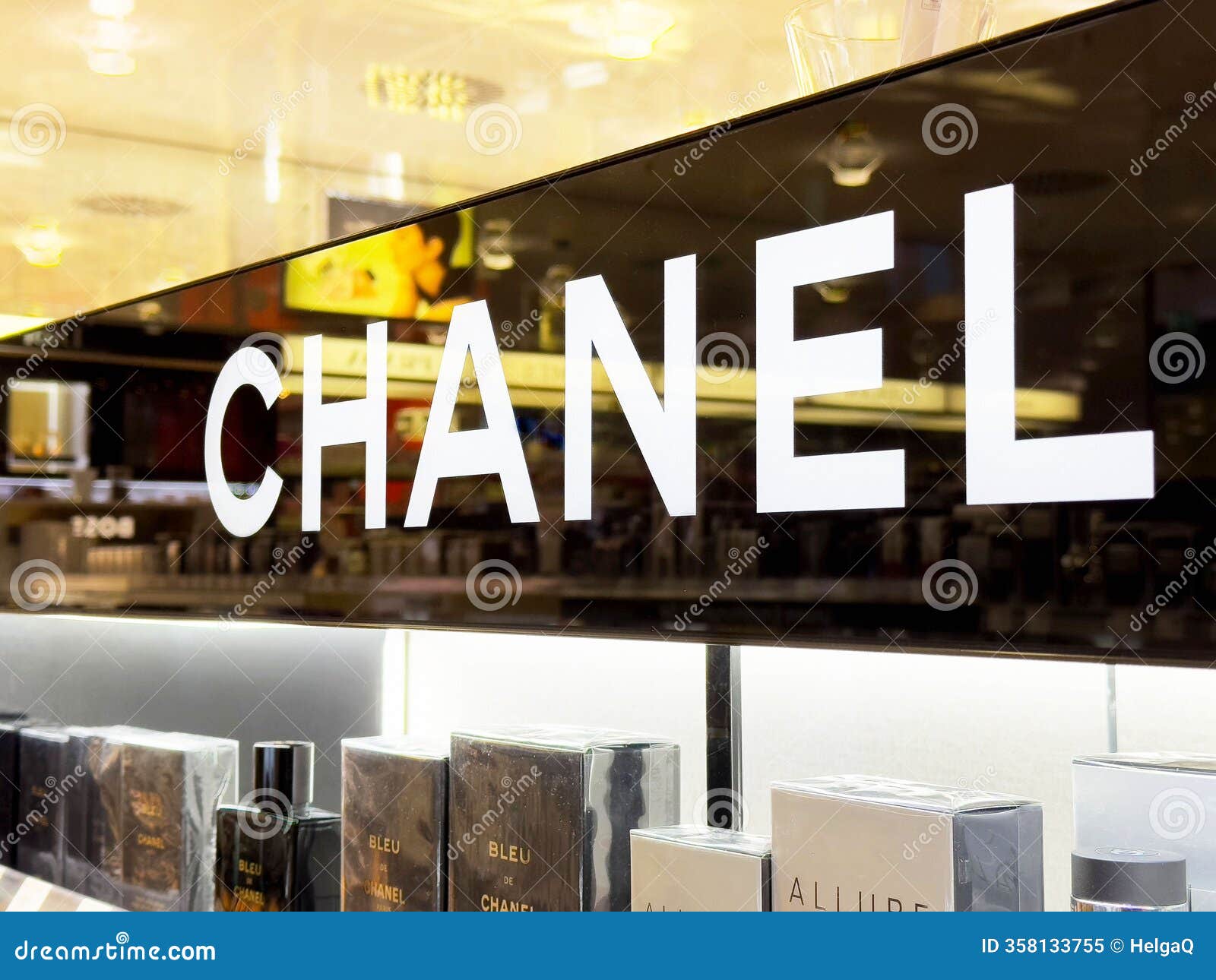 Chanel Perfume Display in a Luxury Store Setting with Elegant Packaging ...