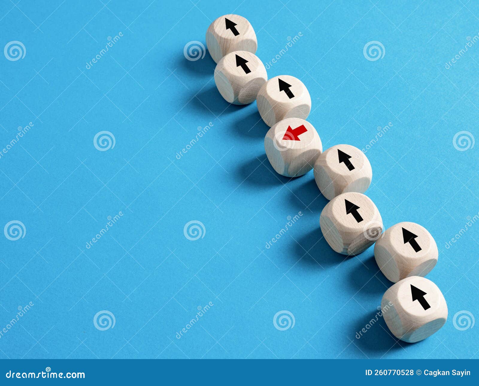 Arrow Signs on Wooden Cubes Forming a Pathway with One Arrow Stands Out ...