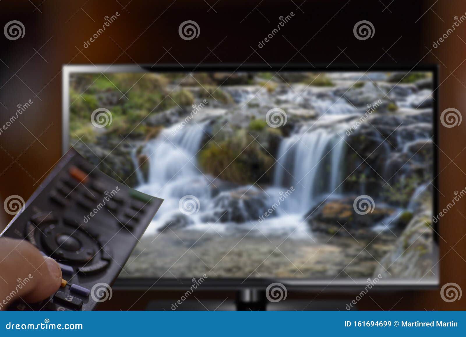 Change TV Channel with Remote Control Stock Image - Image of holding ...