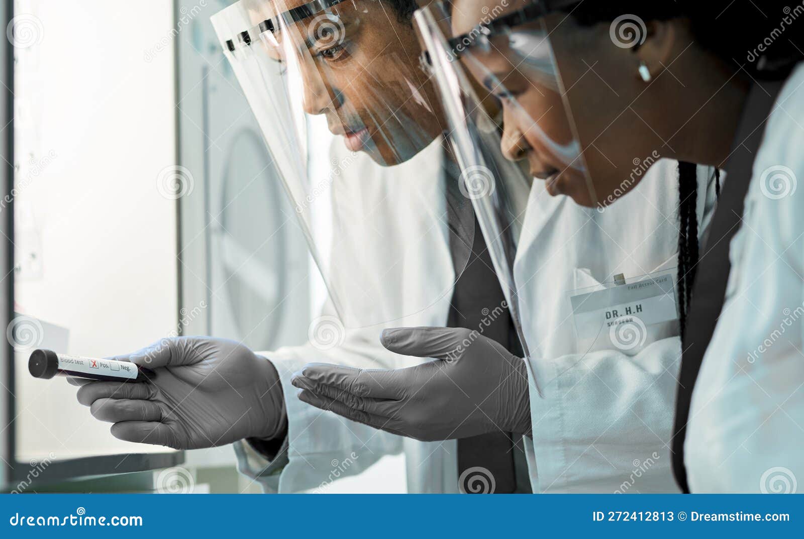 Changing the Future for the Better. Two Scientists Wearing Face Shields while Working Together ...