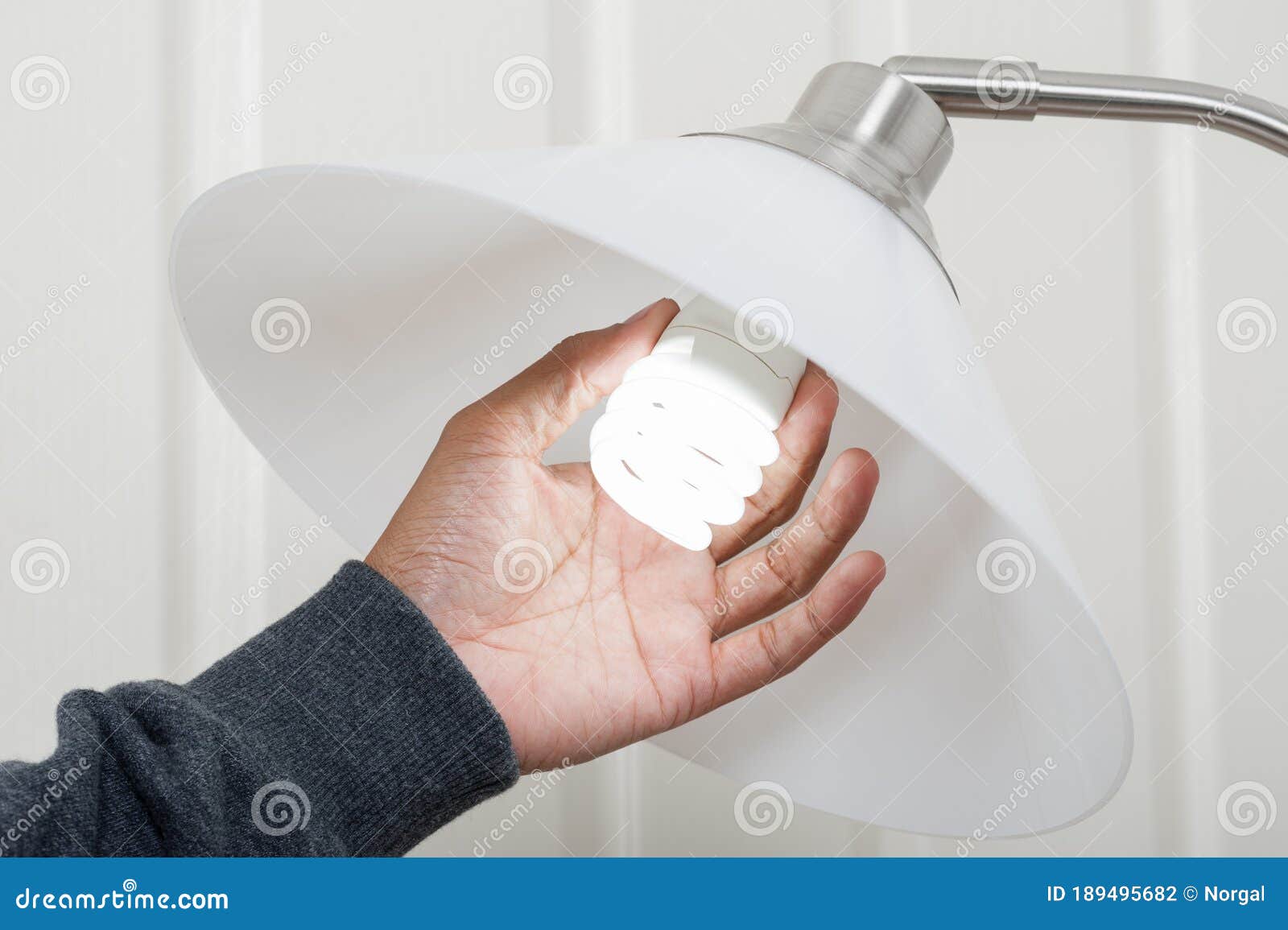 Changing light bulb stock photo. Image of lightbulb - 189495682