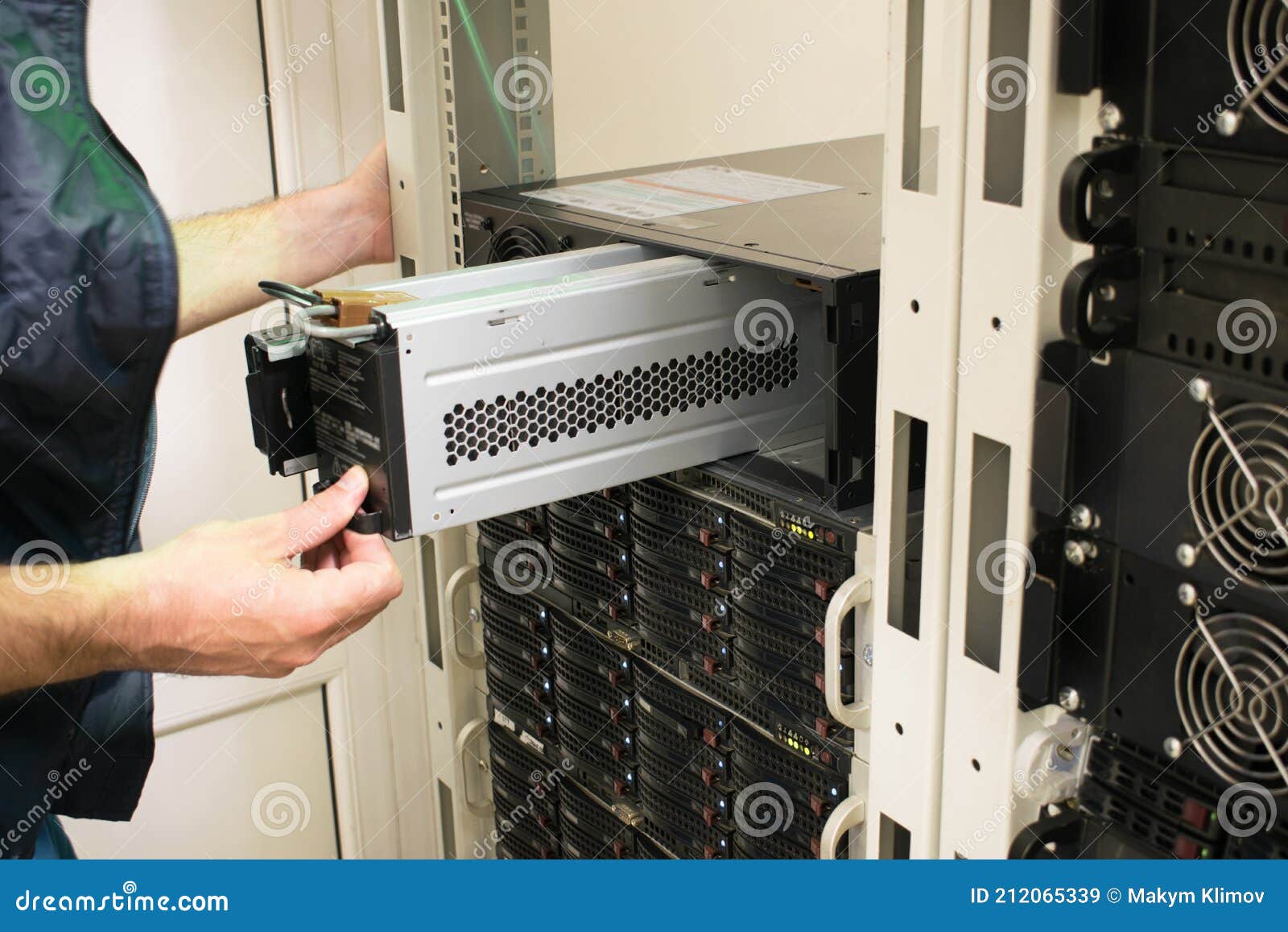 Changing the Power Module in the Server Room Close-up. Working with ...