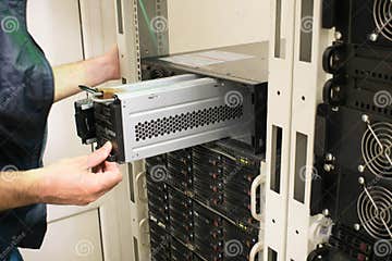 Changing the Power Module in the Server Room Close-up. Working with ...