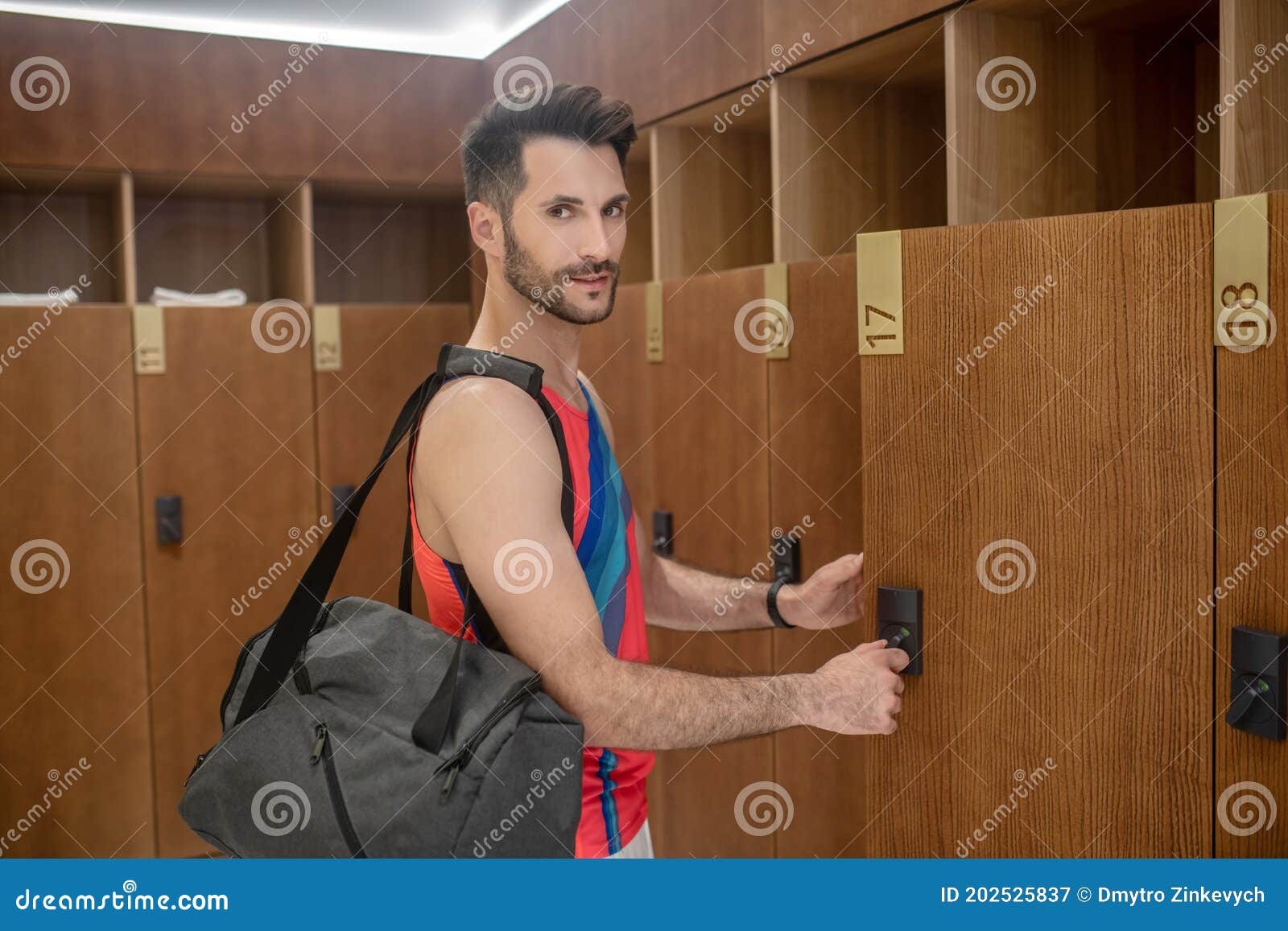 Young Man in Bright Tshirt Opening the Locker Stock Image - Image of ...