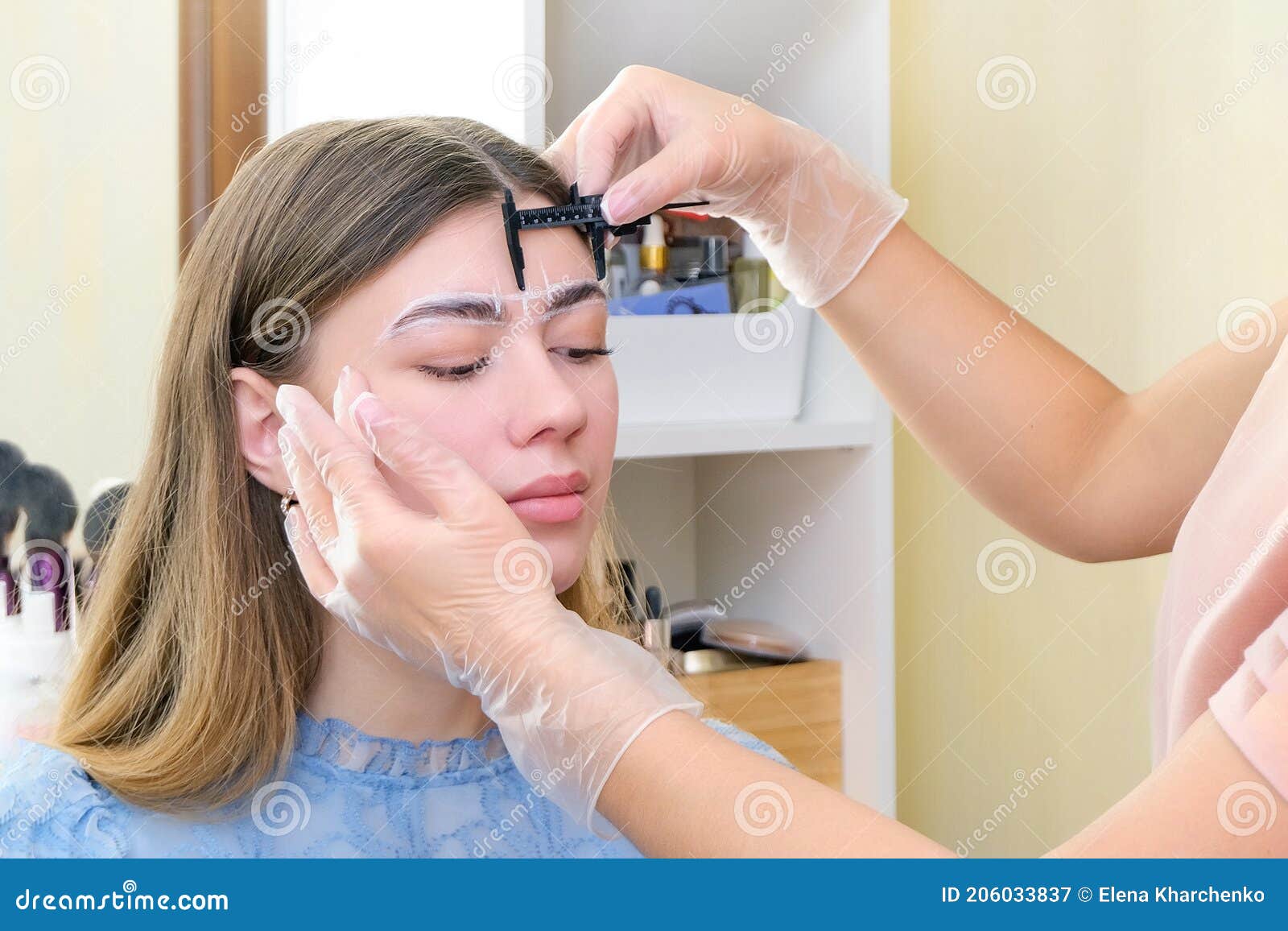 Changing Shape of the Eyebrows. Eyebrow Stylist Measuring Eyebrow with ...