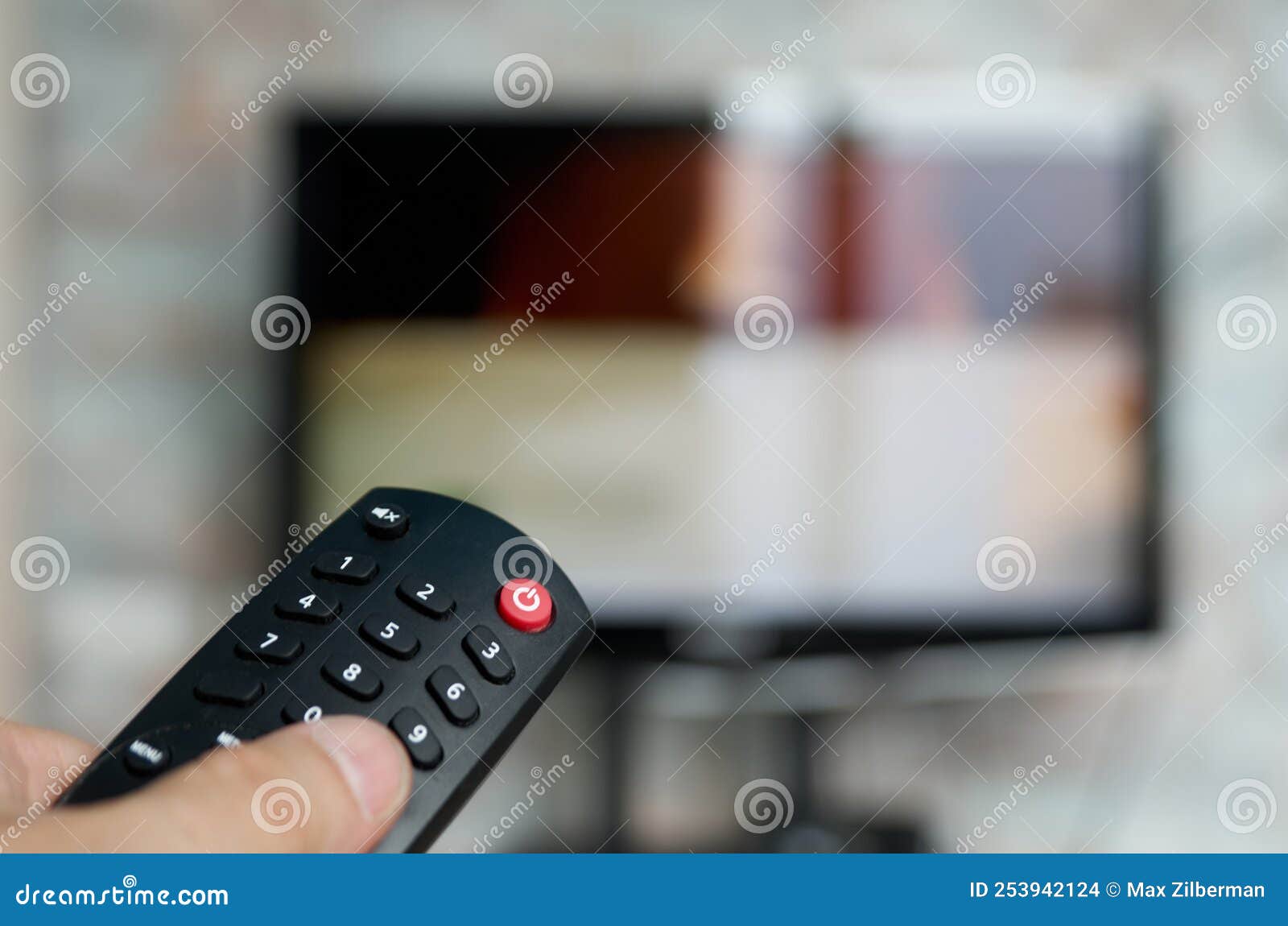 Changing TV Program: Close Up of Human Hand Holding Television Remote ...
