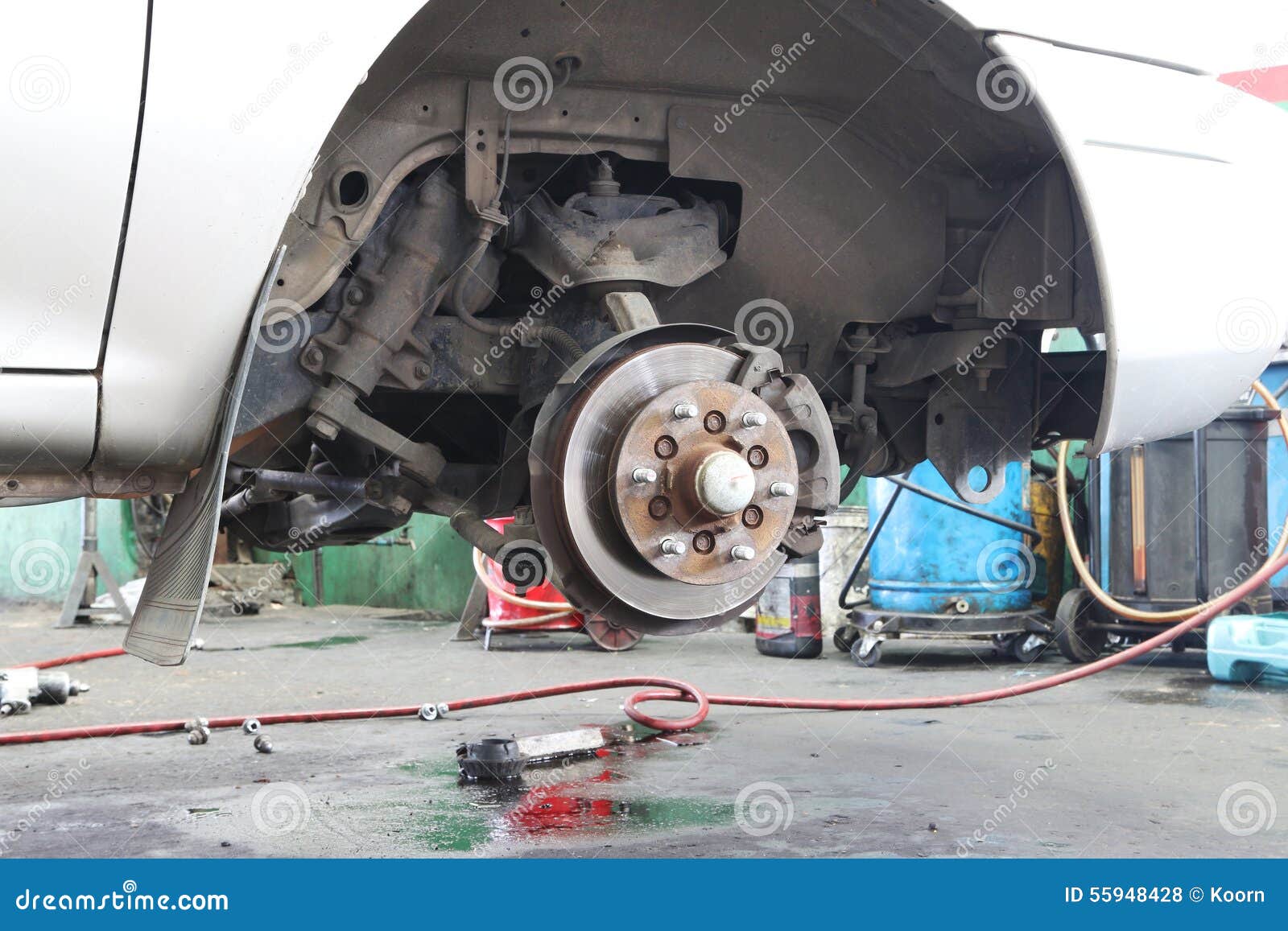 Changing a wheel on a car stock photo. Image of mechanical - 55948428