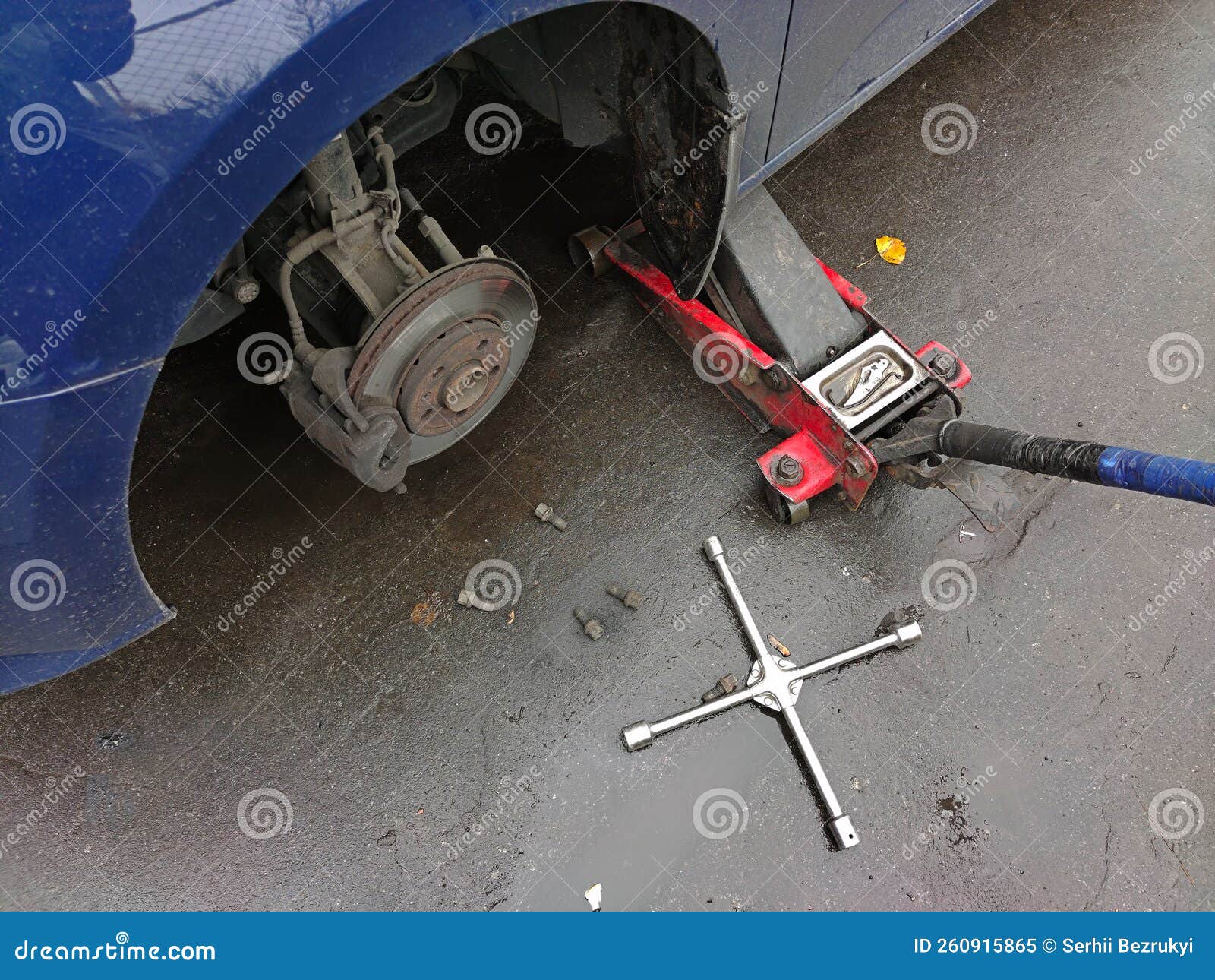 Changing a Wheel on a Car Jack at a Car Service Station Stock Image ...