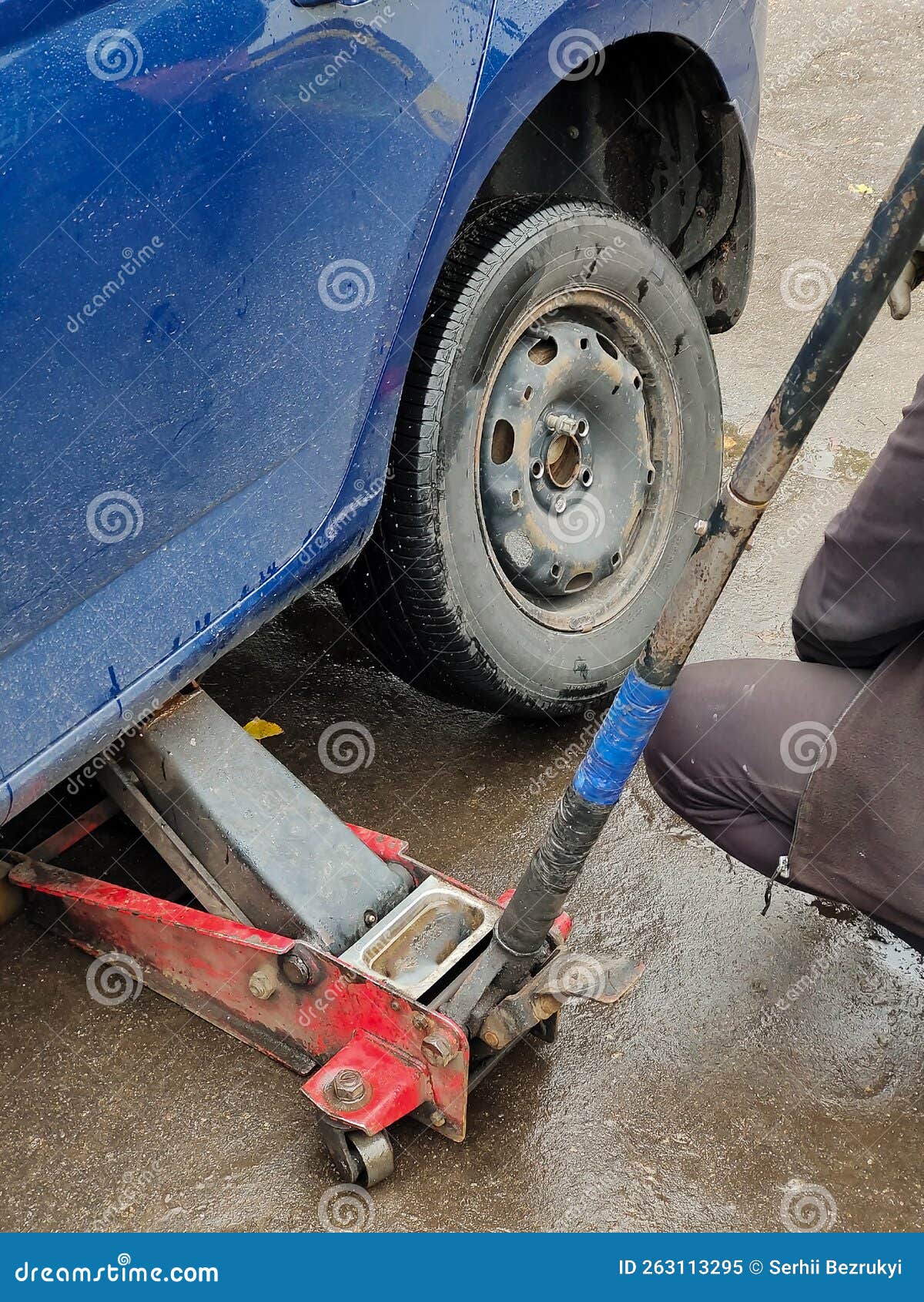 Changing a Wheel on a Car Jack at a Car Service Station Stock Image ...