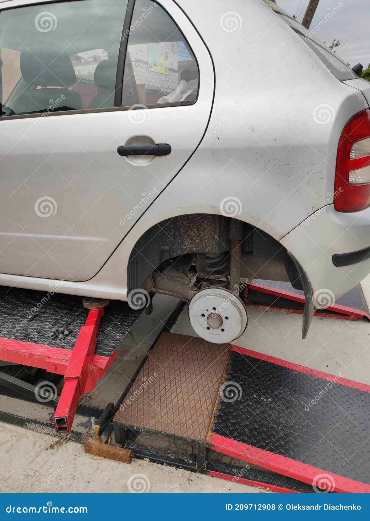 Changing Wheels in the Spring on a Passenger Car Stock Photo - Image of ...