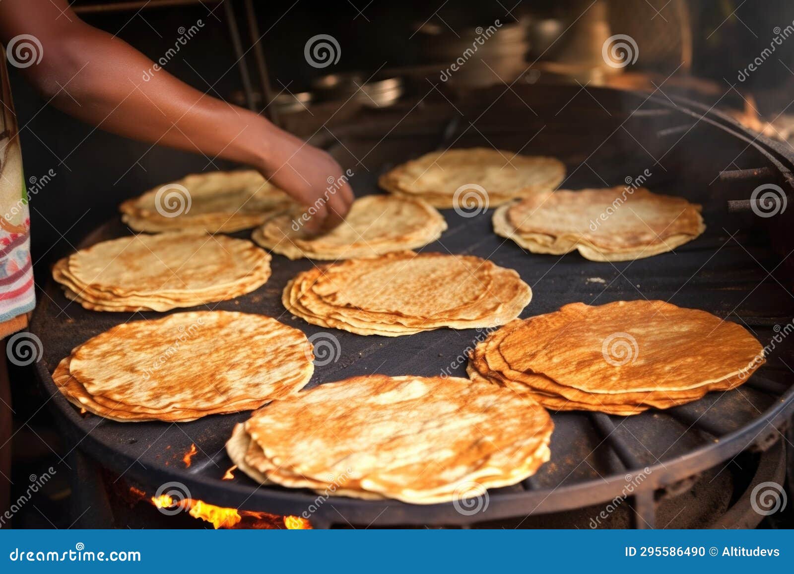 Chapatis Getting Roasted on a Griddle by Hand Stock Photo - Image of ...