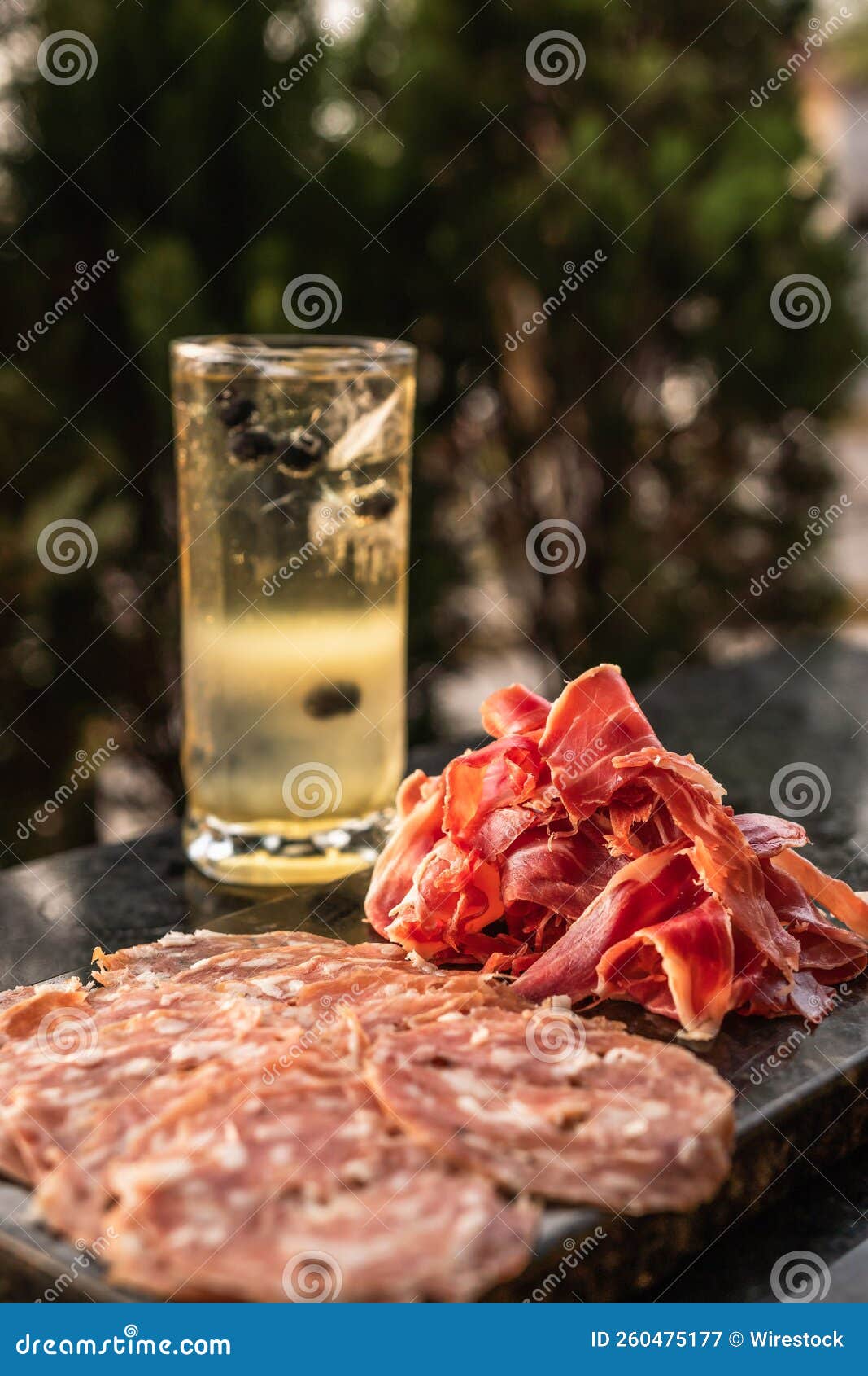 Charcuterie Board of Hams Along with an Alcoholic Drink Based on ...