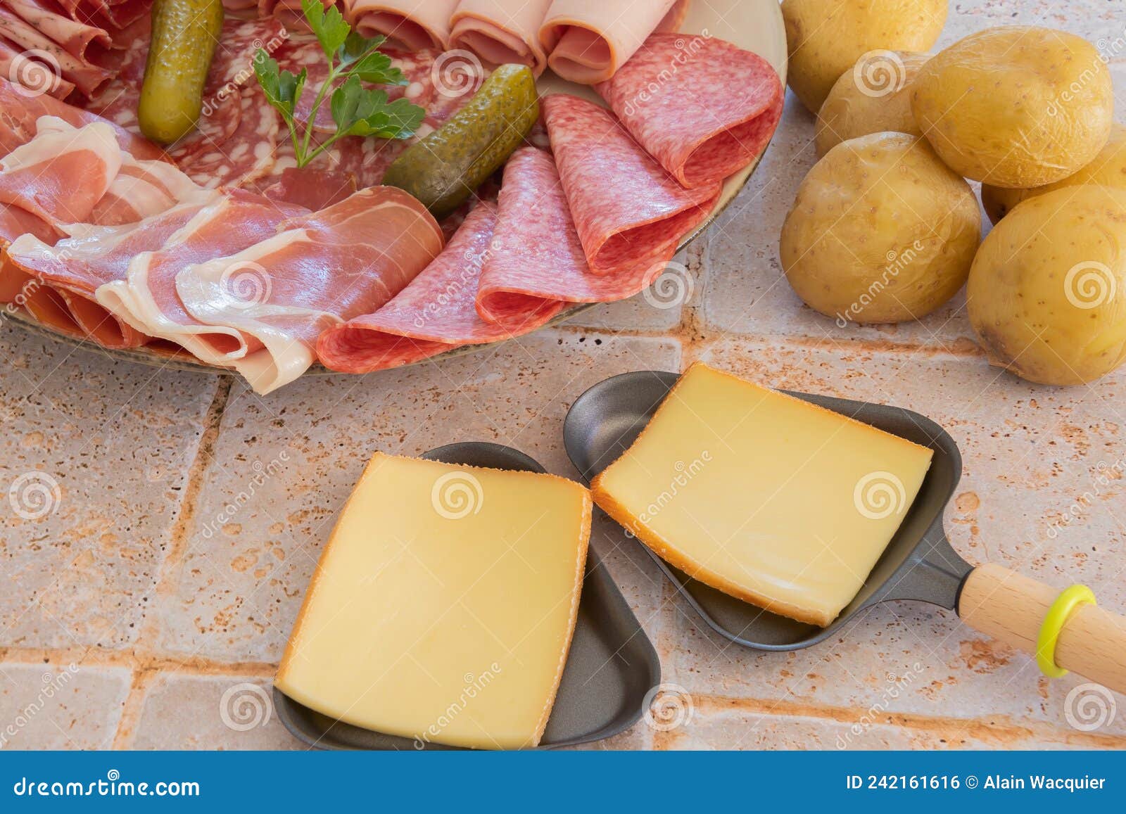 Charcuterie in a Dish with Raclette Cheese Stock Photo - Image of ...