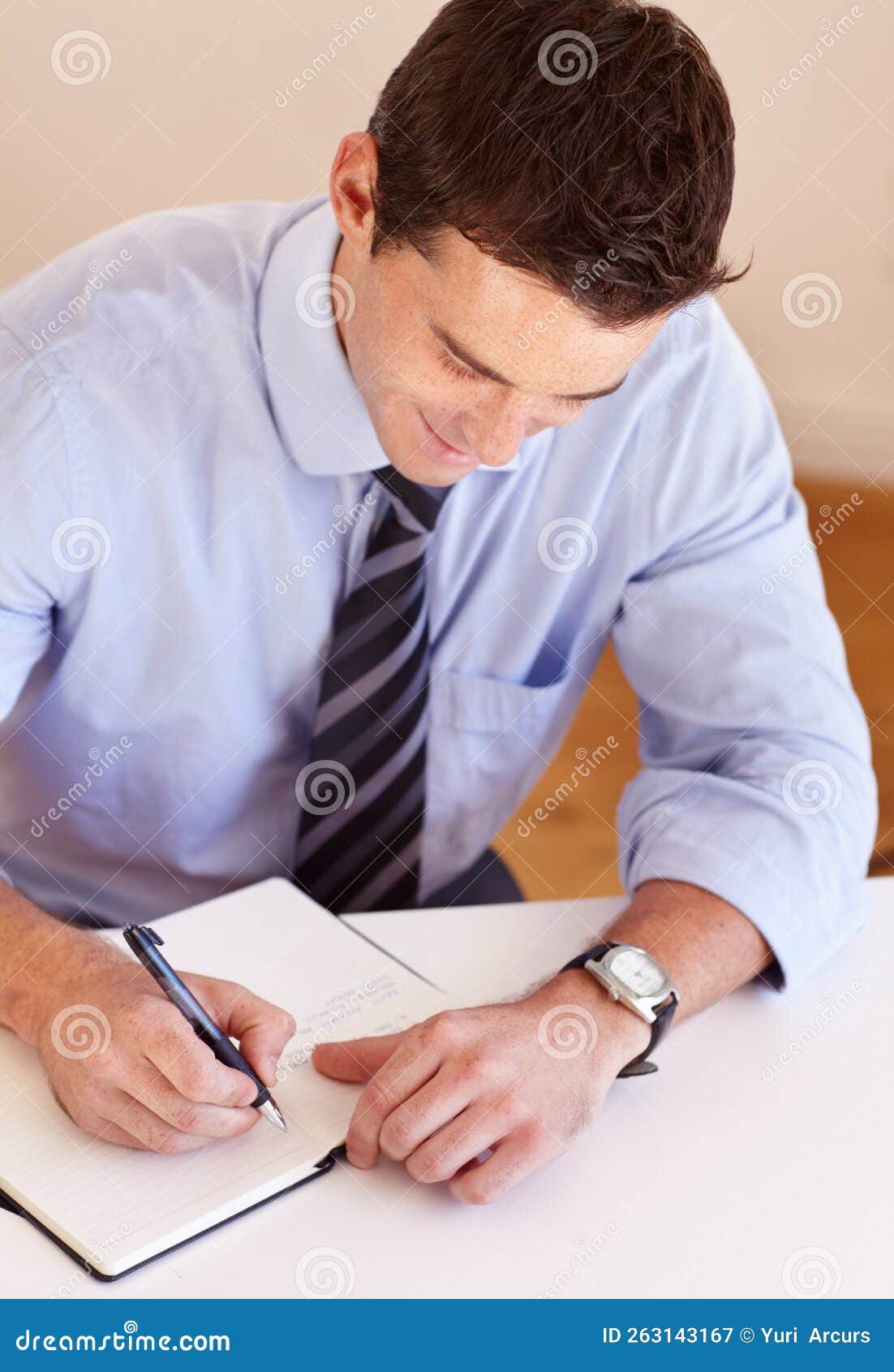 In Charge of His Schedule. Young Businessman Filling in His Dayplanner ...