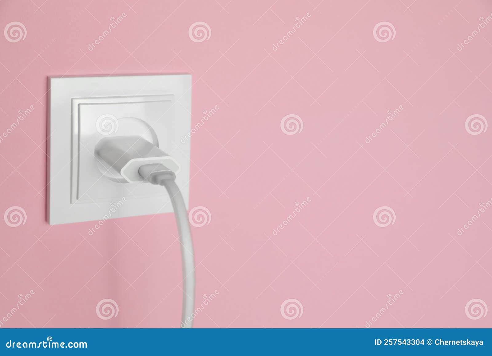 Charger Adapter Plugged into Power Socket on Pink Wall, Space for Text ...