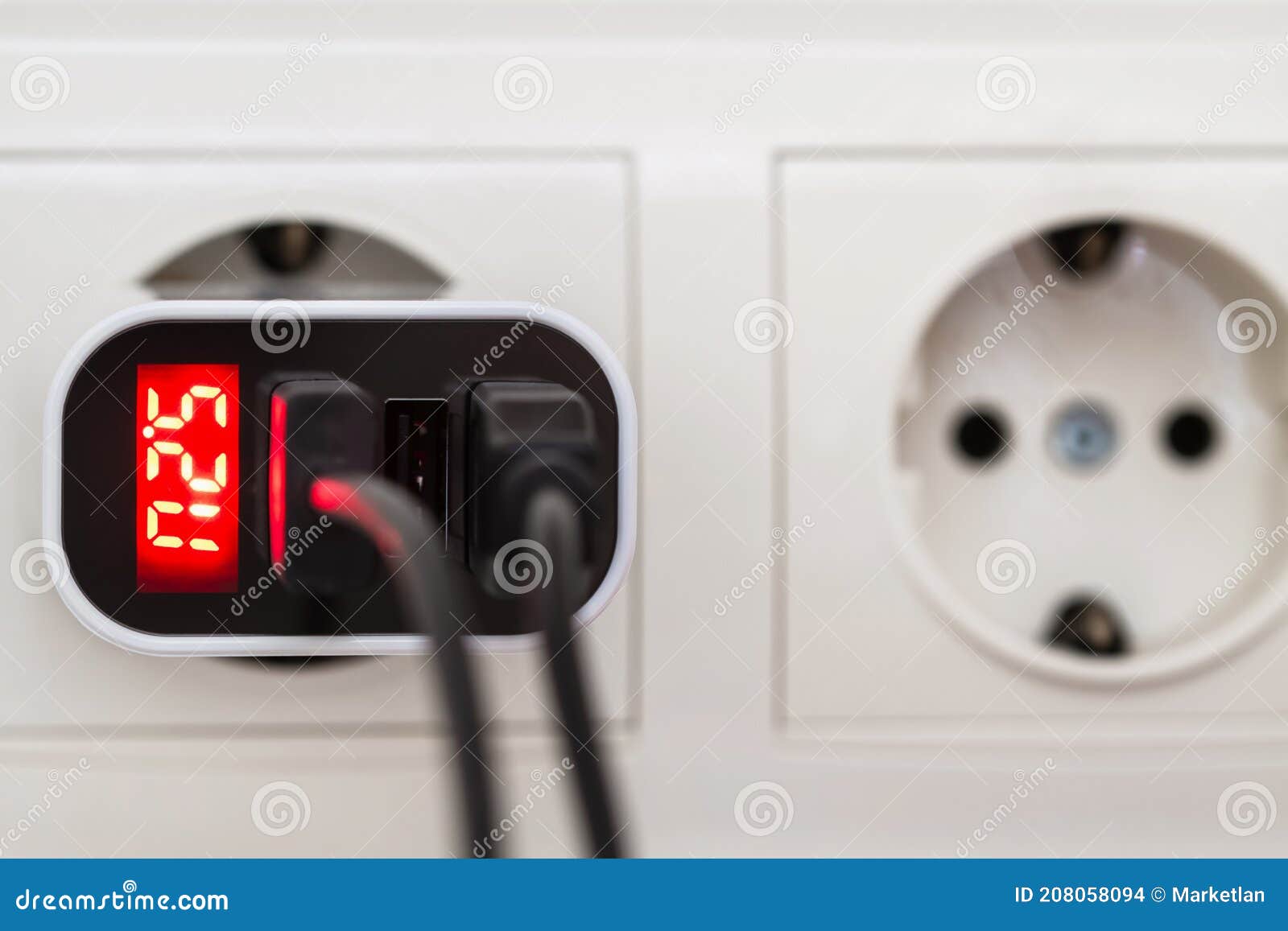 The Charger is Plugged in. Mobile Devices are Charging from Socket ...