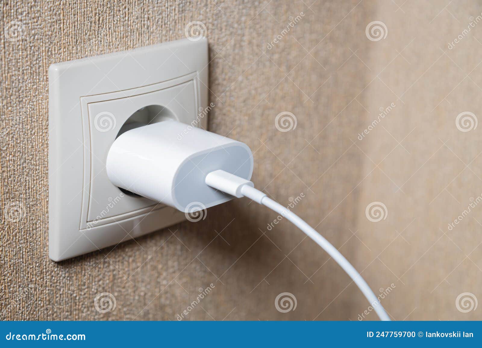 Charger in the Socket on the Wall, Close-up Stock Photo - Image of ...