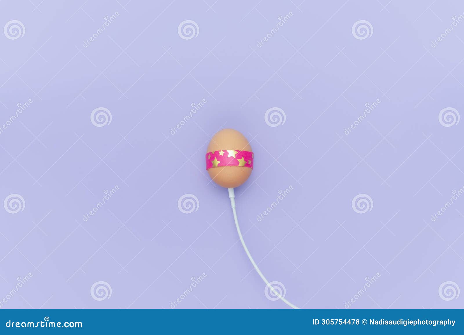 Charging Easter Egg with Cable. Loading Simple Background Stock Photo ...