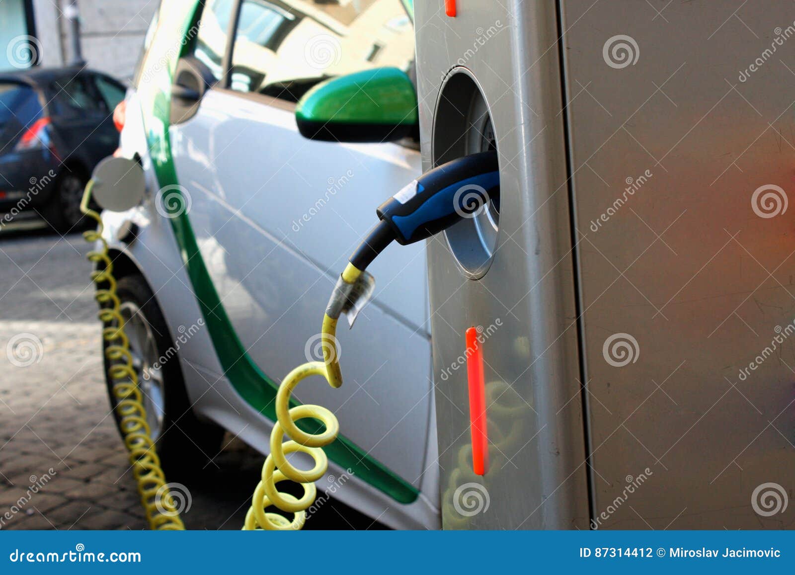 Charging an Electric Car with the Power Cable Supply Plugged in. Stock ...