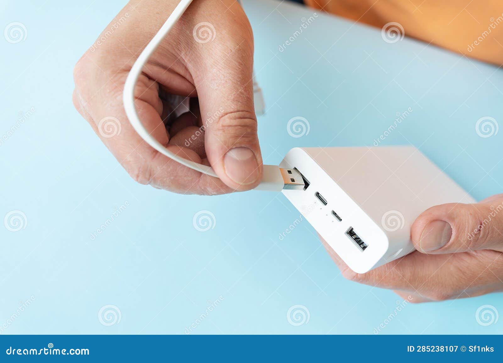 Charging a Power Bank, a Man Connects the Cable To the Cell Stock Image ...