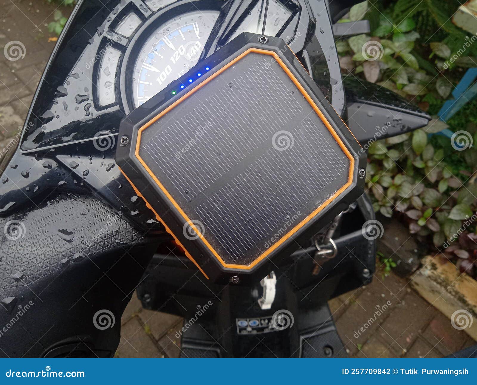 Charging Process Power Bank from Direct Sun, at Motorcycle Dashboard ...