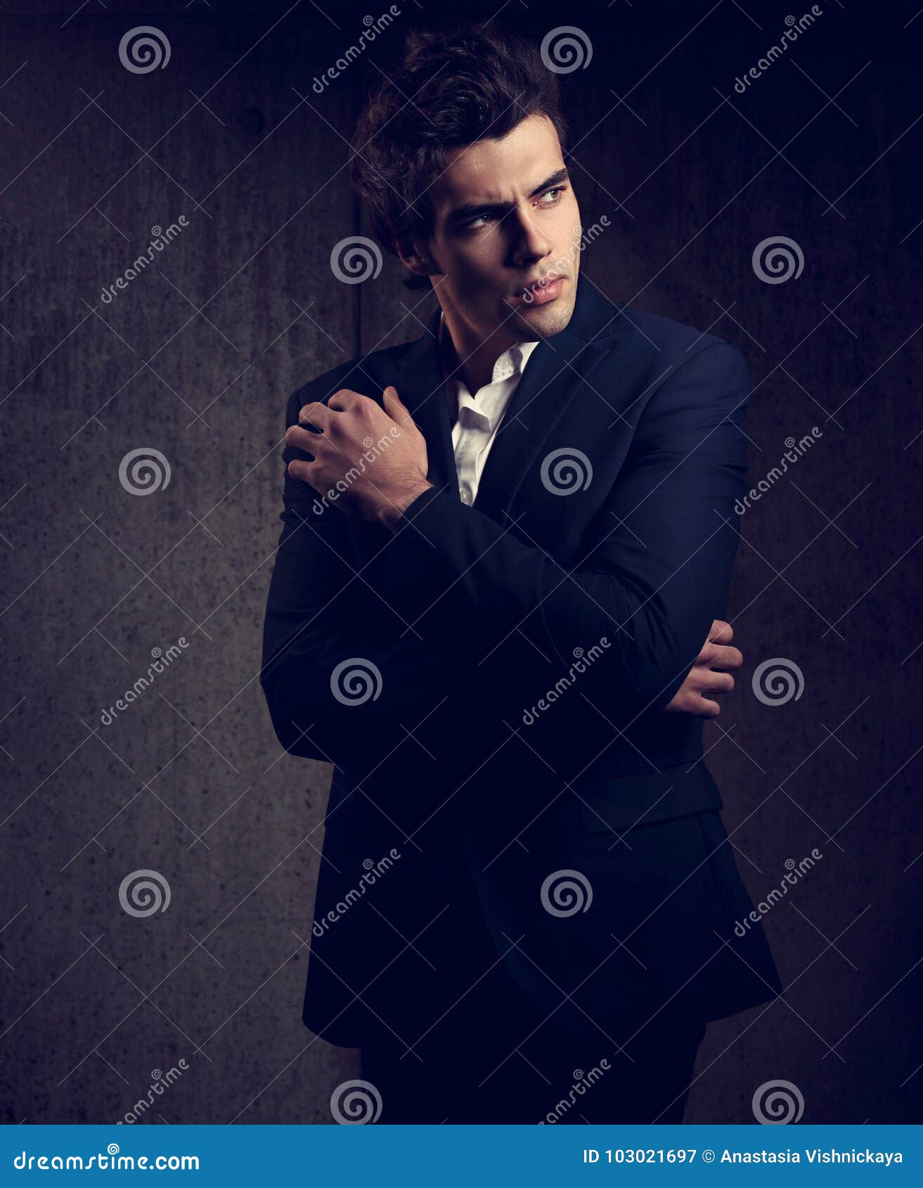 Charismatic Handsome Male Model Posing In Blue Fashion Suit And Stock