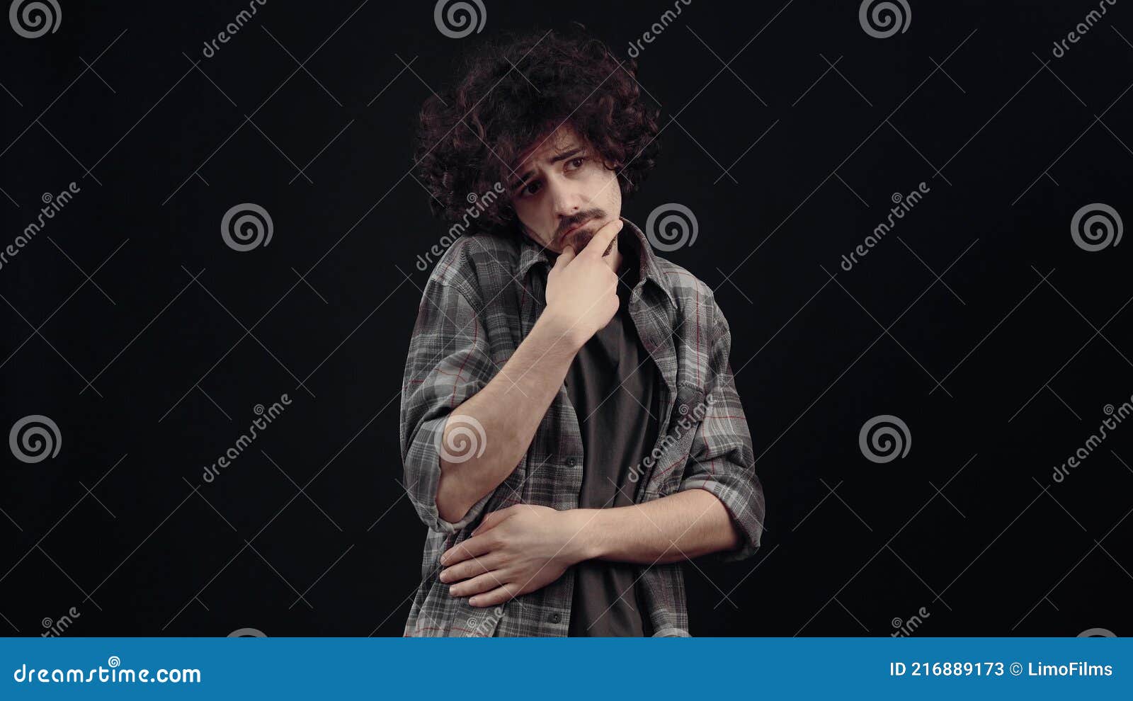 The Charismatic Young Man Raises His Shoulders and Hands in a Sign of ... The Charismatic Young Man Raises His Shoulders and Hands in a Sign of ...