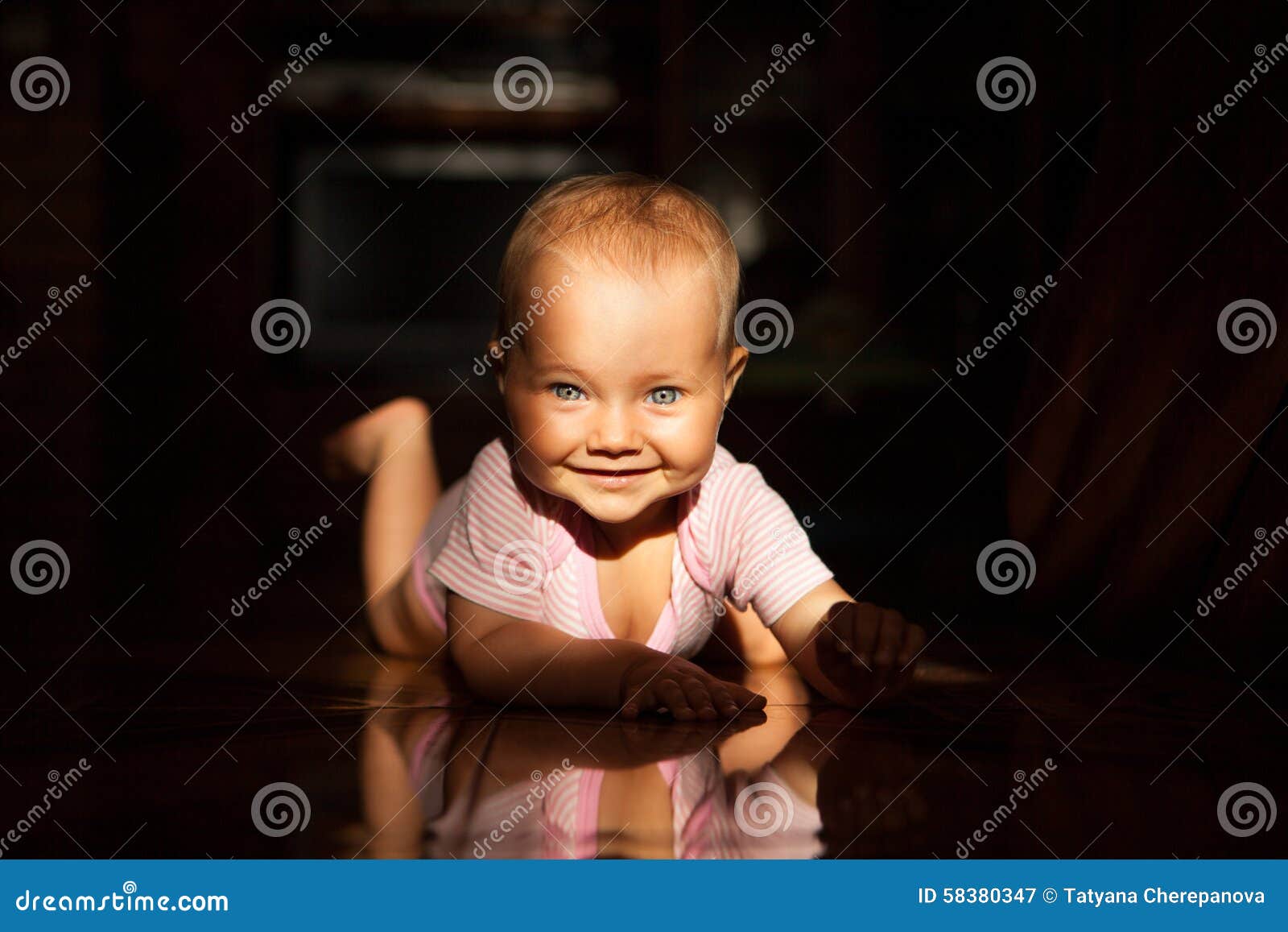 Charming Baby Crawling Forward Illuminated by the Sun Stock Image ...