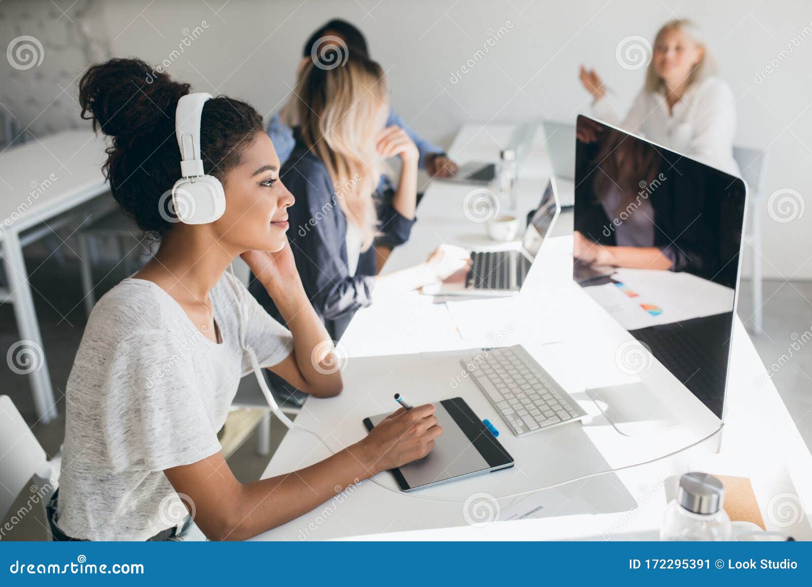 Charming Black Web-developer Listening Music in Big Headphones and ...