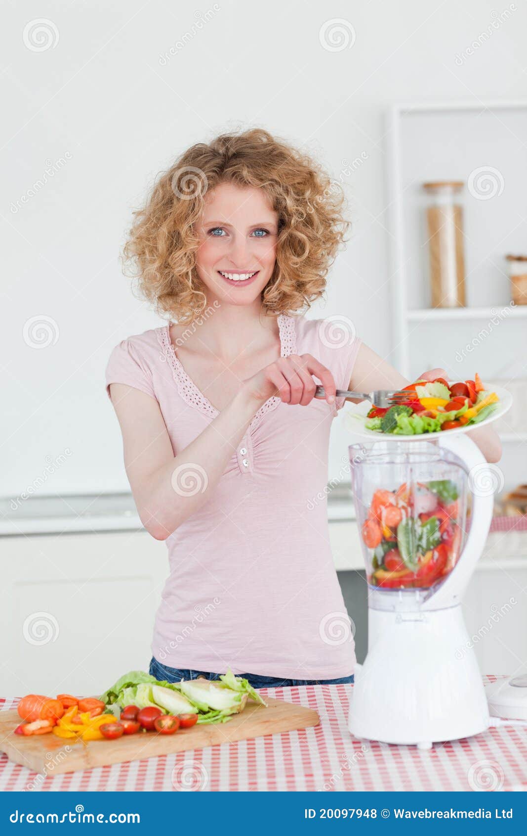 Charming Blonde Woman Using a Mixer in the Kitchen Stock Photo - Image ...