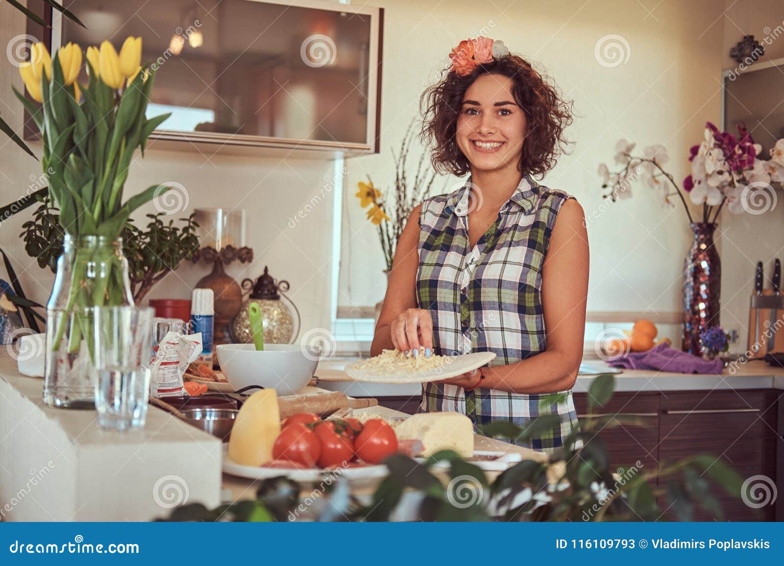 Charming Curly Hispanic Girl Cooking in Her Kitchen. Stock Image ...
