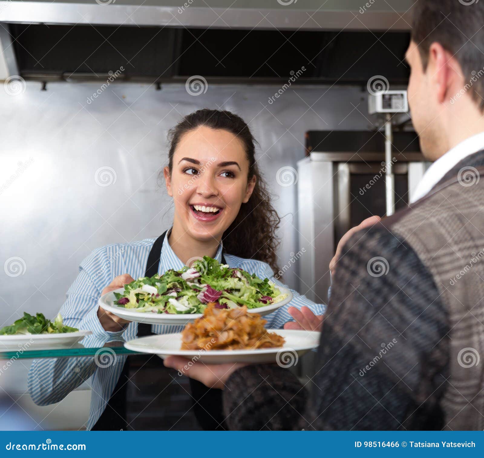 Charming Female Worker Serving Customer with Smile Stock Photo - Image ...