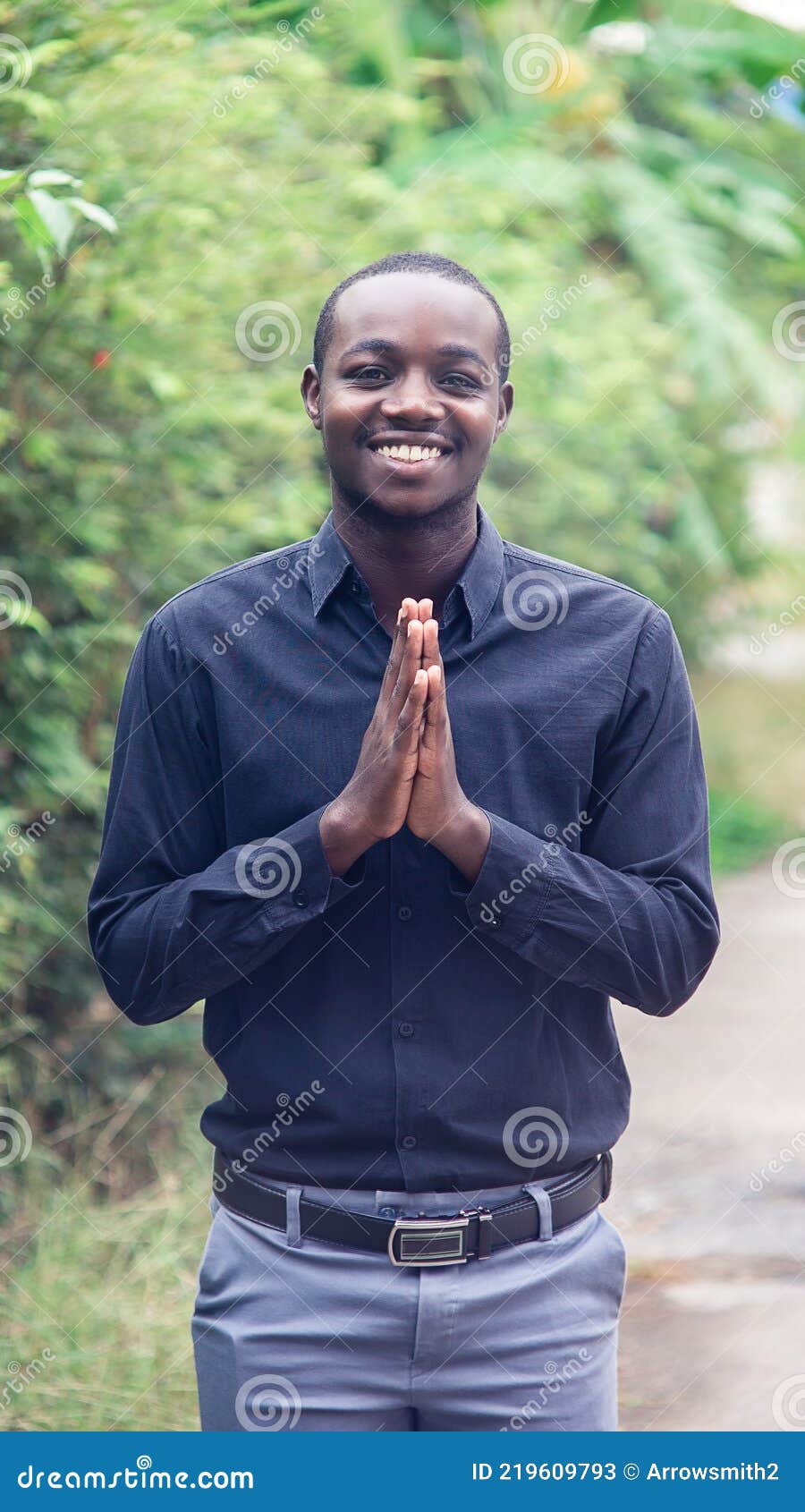 A Charming, Friendly African Man Who Stands Smiling and Shows Sincere ...