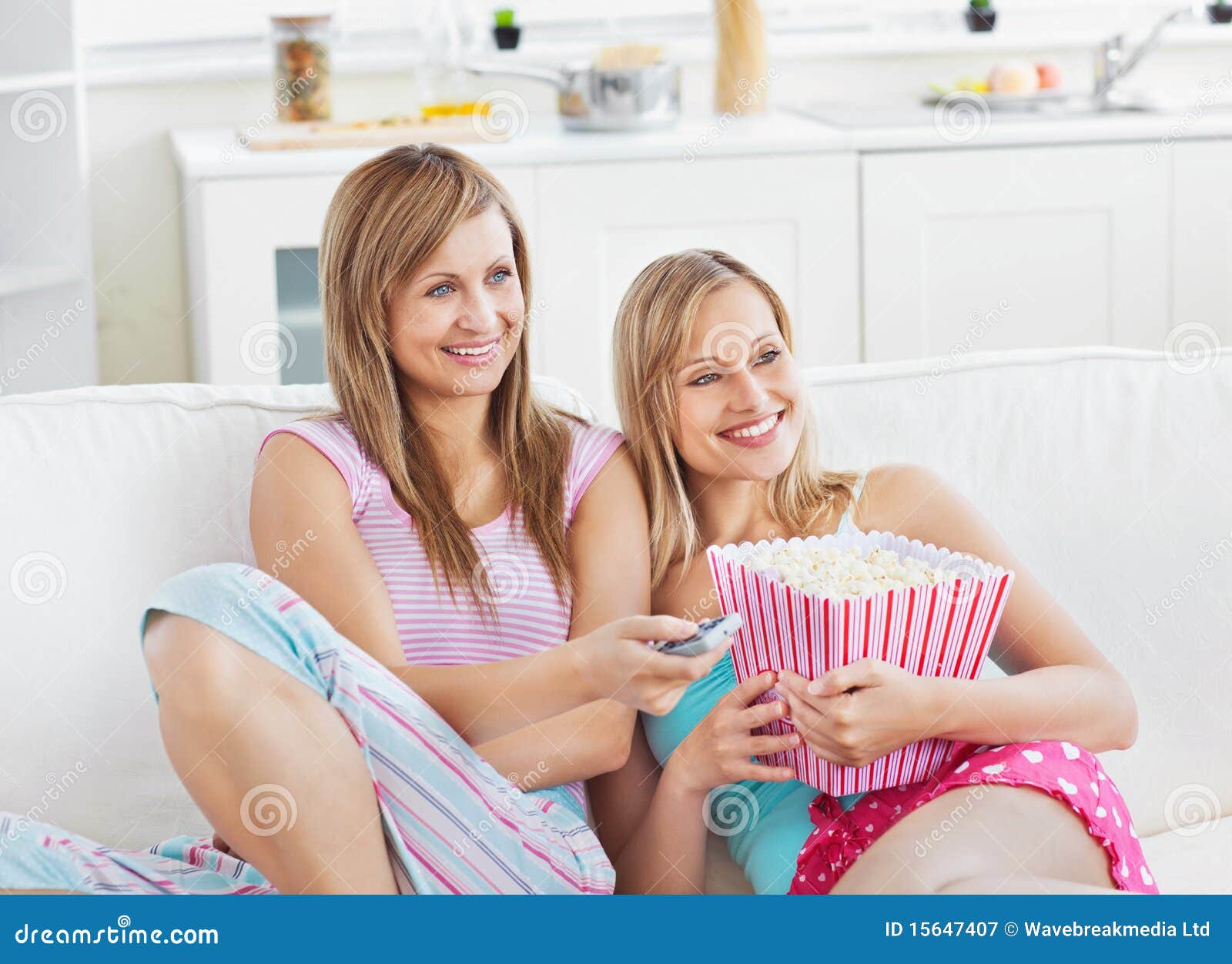 Charming Friends Watching Tv Eating Popcorn Stock Image - Image of ...