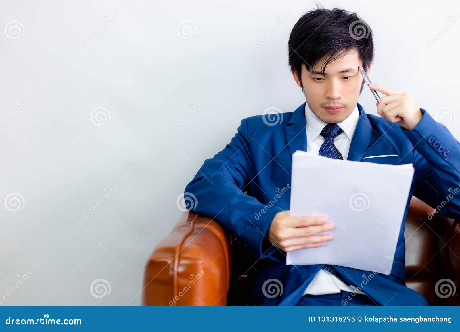 Charming Handsome Young Guy is Thinking His Work for Solving Pro Stock ...