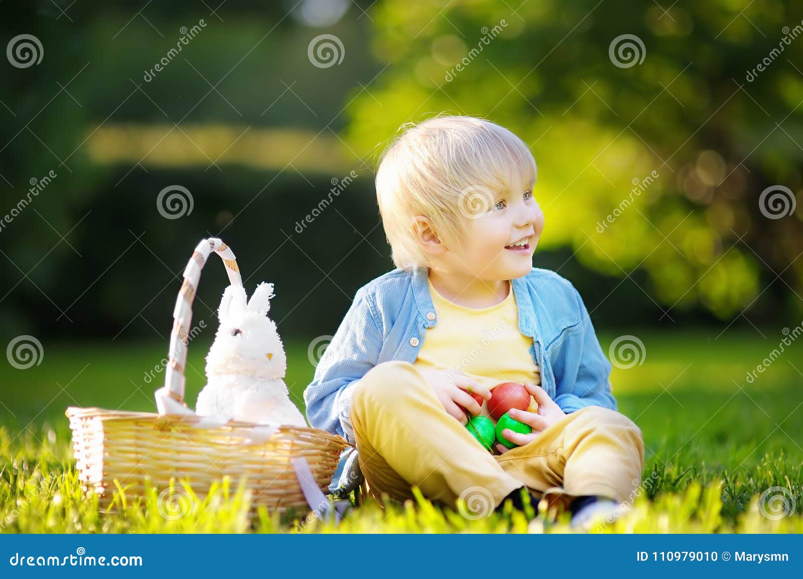 Charming Little Boy Hunting for Easter Egg in Spring Park on Easter Day ...